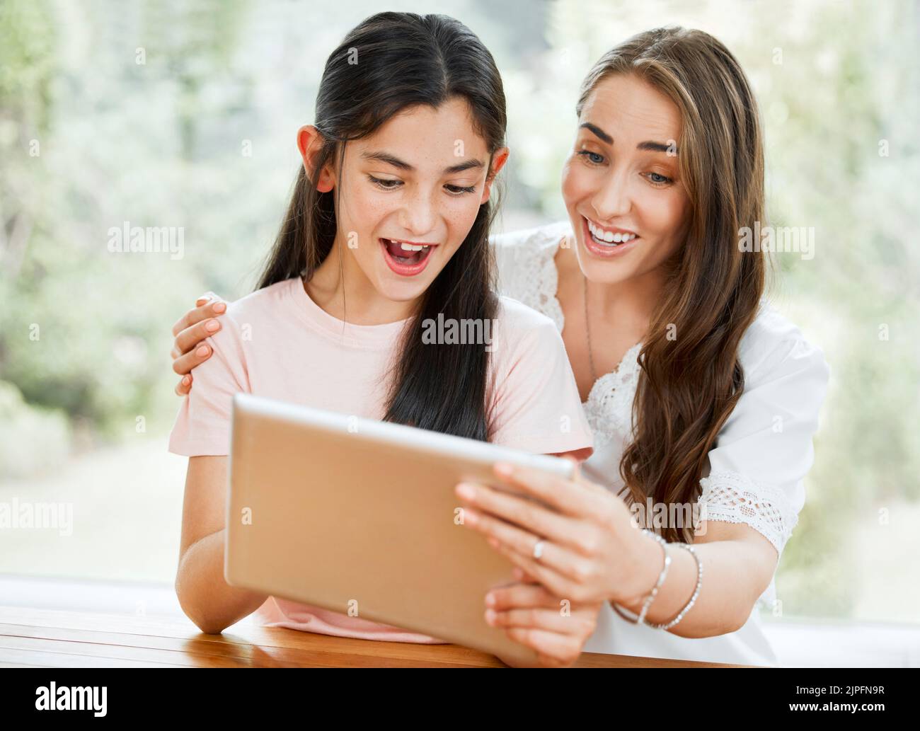 Mother, tablet and child looking excited about learning together on an ...
