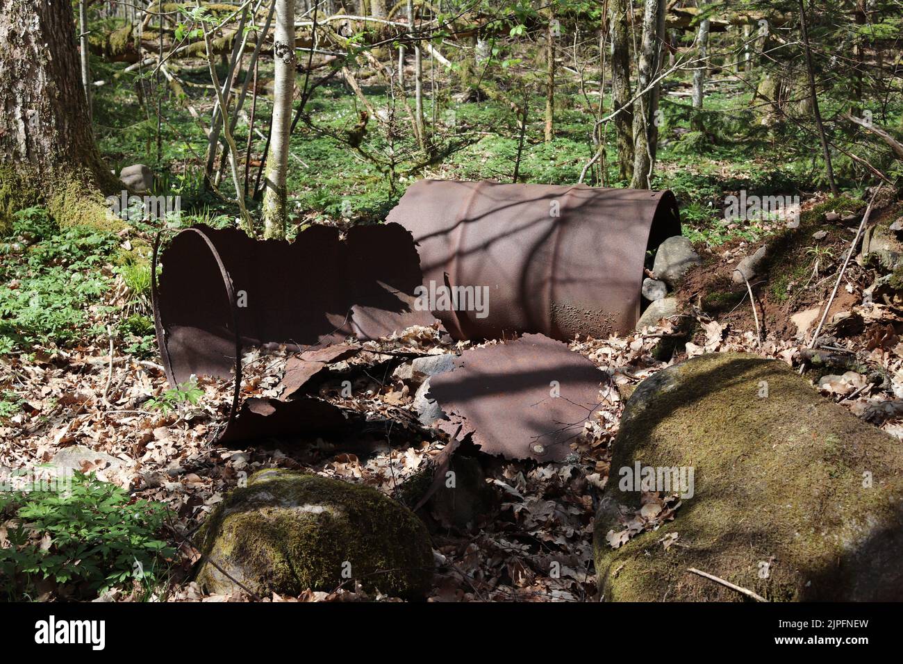 The broken containers in the nature - environment pollution concept ...