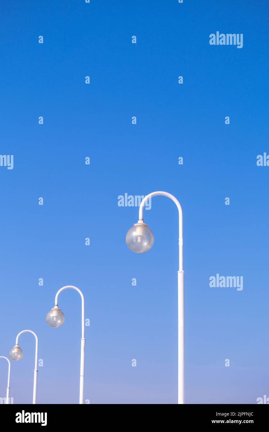 Street lights at daytime on blue sky background. Creative abstract ...