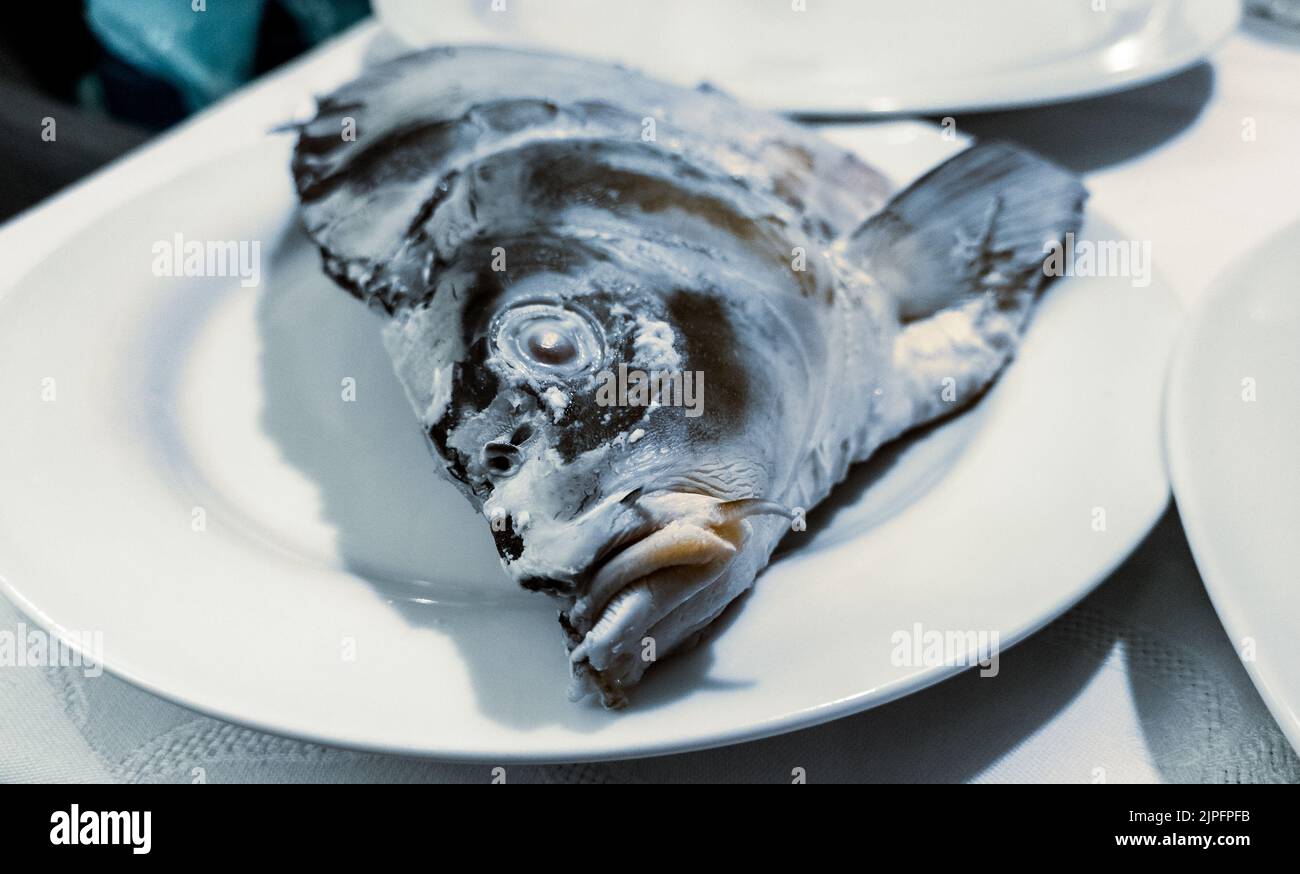 Hamburg, Germany. 17th Aug, 2022. Half a carp blue lies on a plate. The ...
