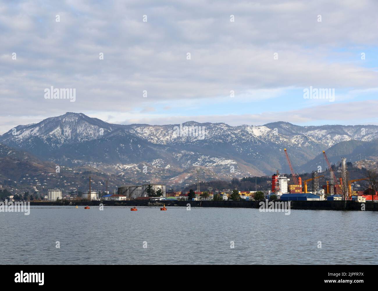 BATUMI,GEORGIA-DECEMBER 31:Cloudy sky and Snowy Mountains from the Port ...