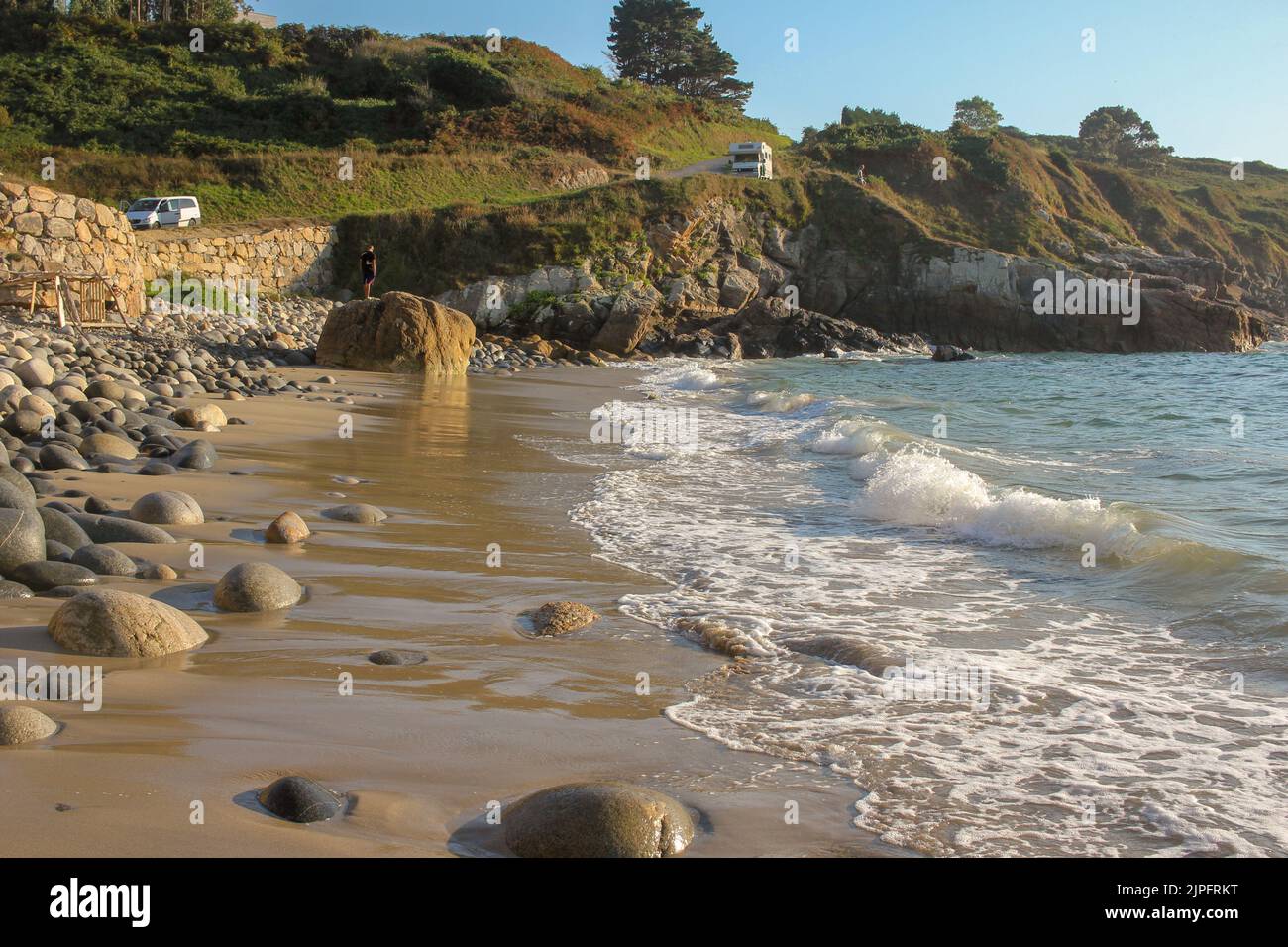 Rocky and lonely beach with cold water in the Cantabrian sea Stock ...
