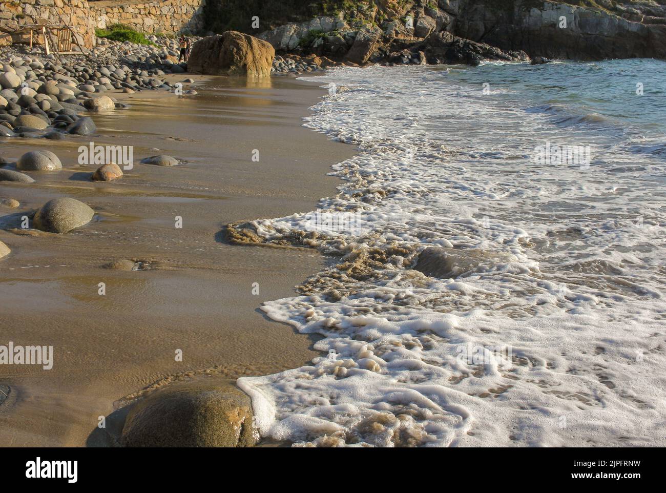 waves reaching the coast in a rocky beach in the north of Spain Stock ...