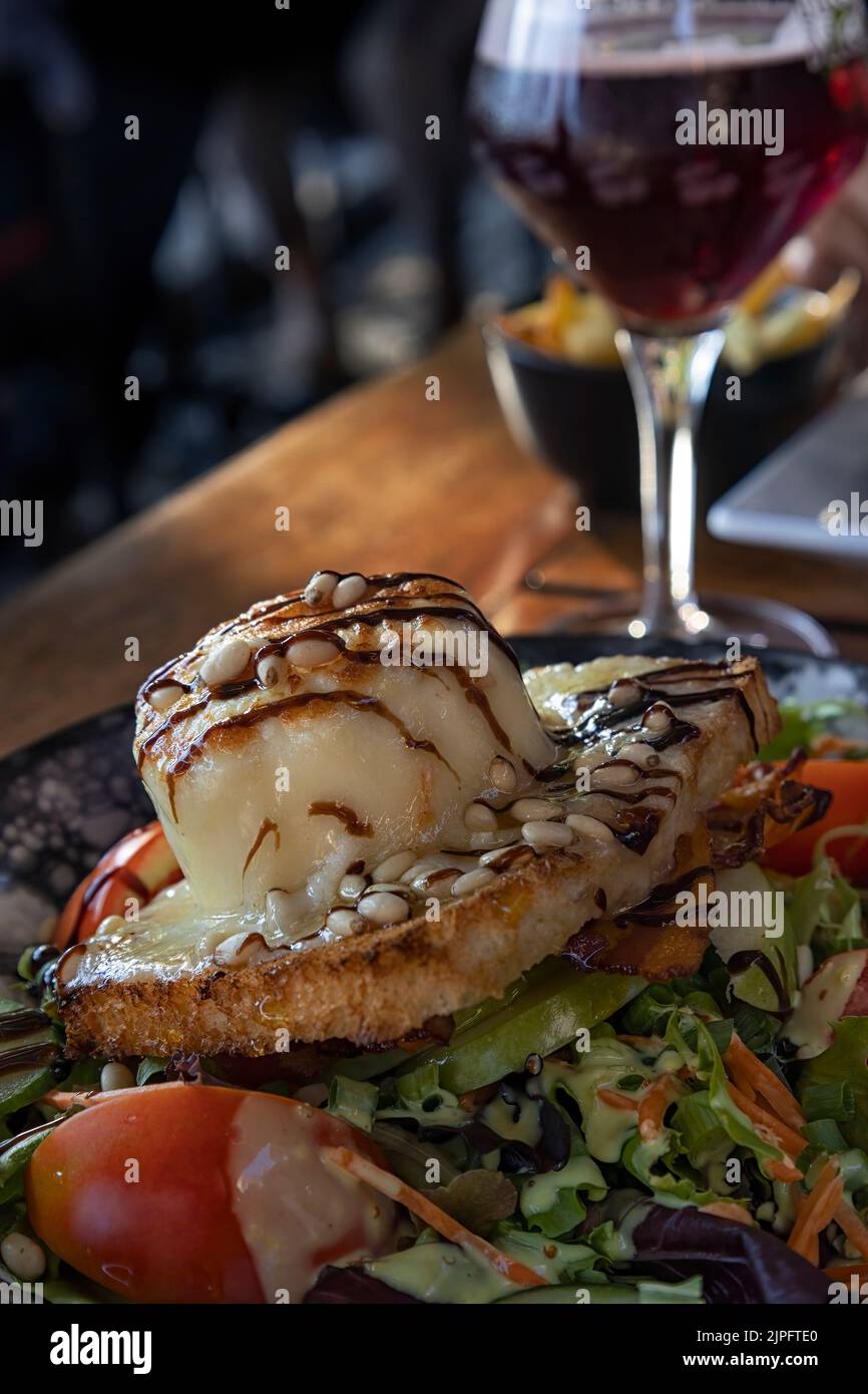Goats cheese salad with croutons and fries Stock Photo - Alamy