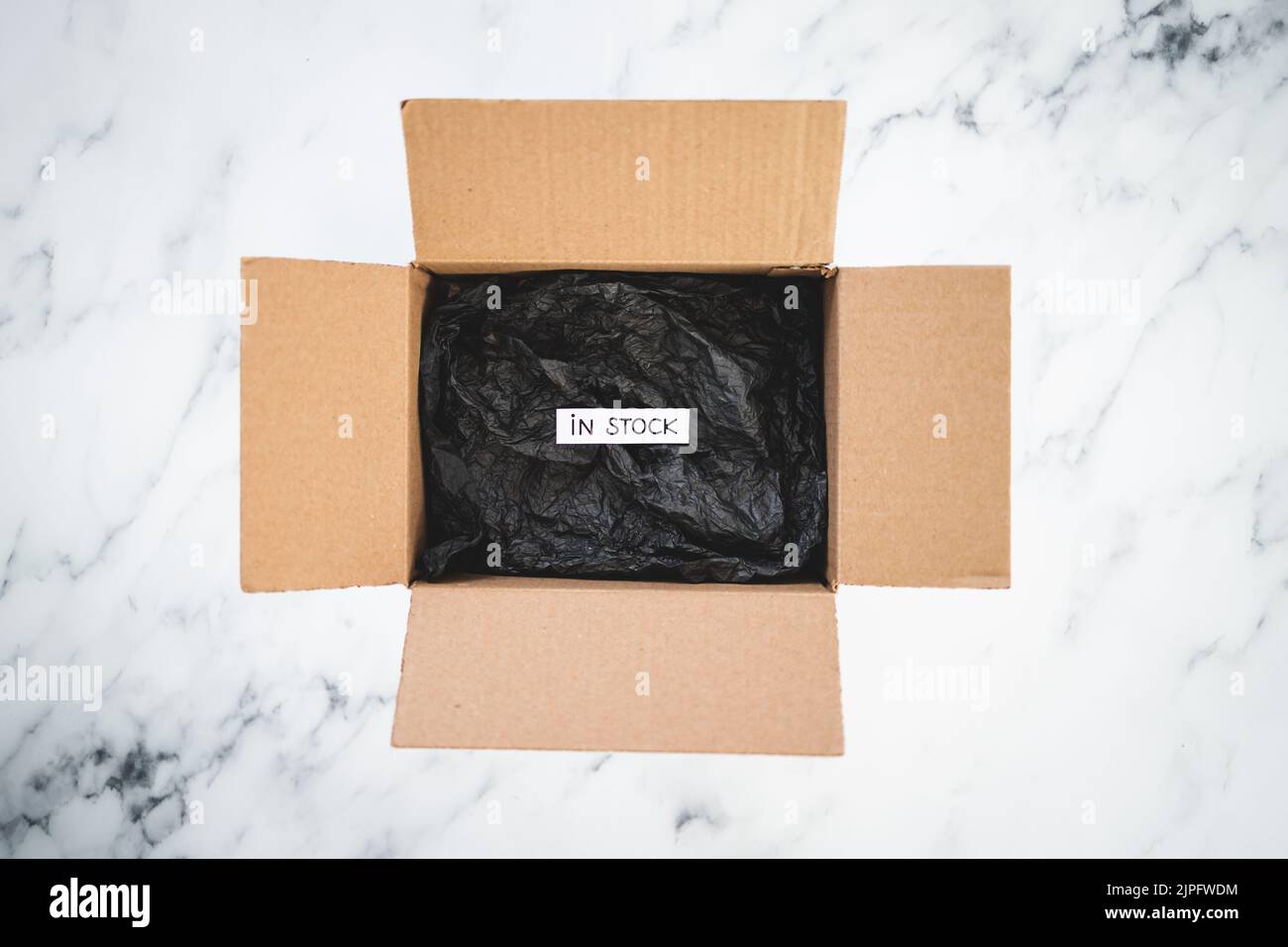 In stock text inside of delivery parcel from online shopping, concept ...