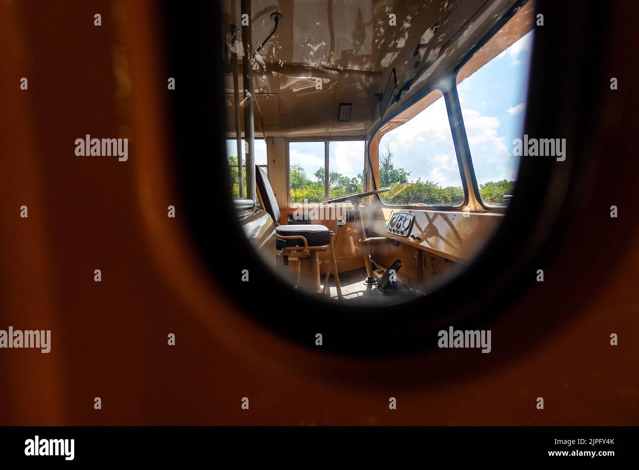 The interior of a 1951 Brill school bus, viewed through the main door ...
