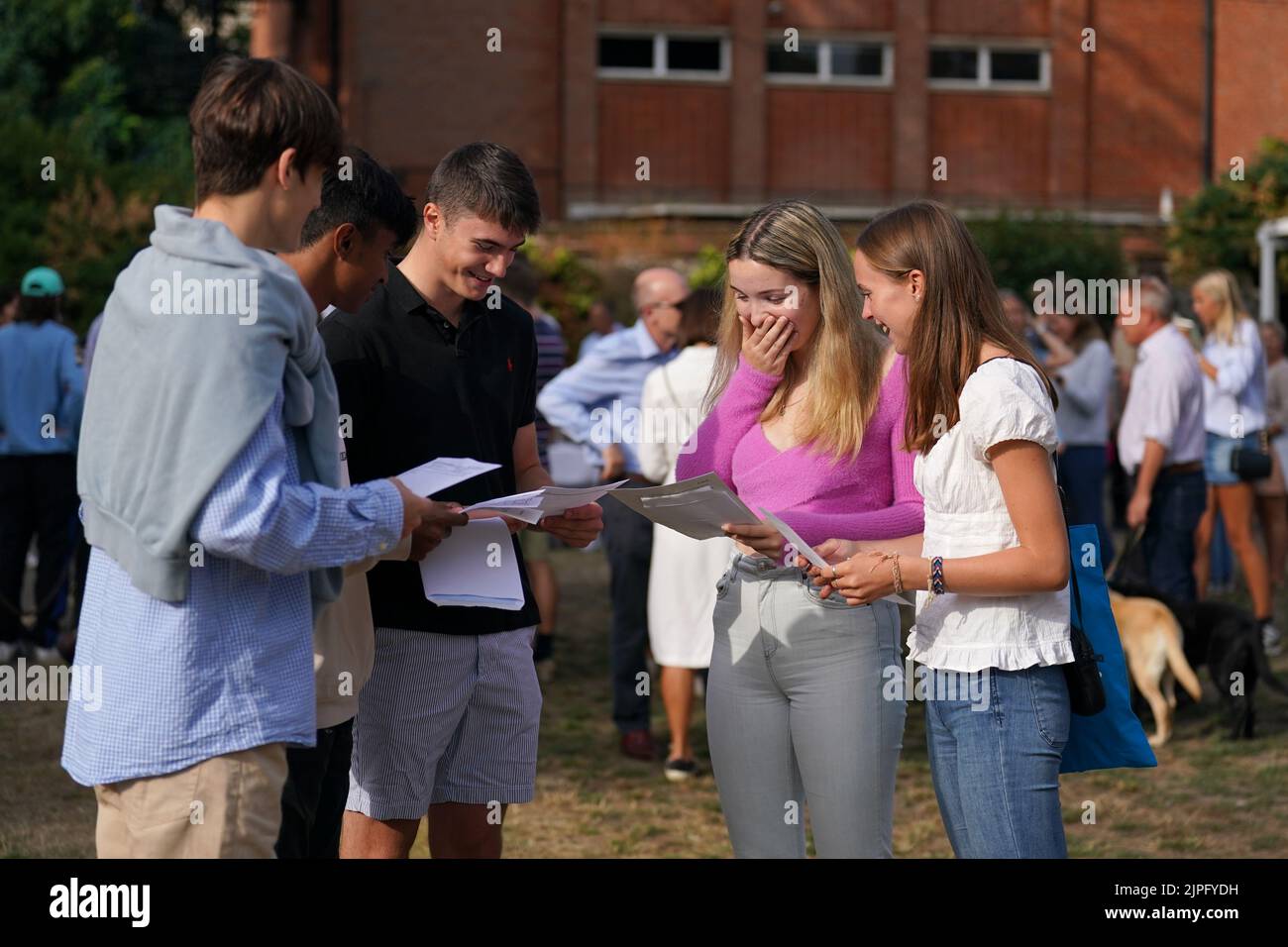 Anna Austin (centre-right) reacts when reading their A-level results at ...