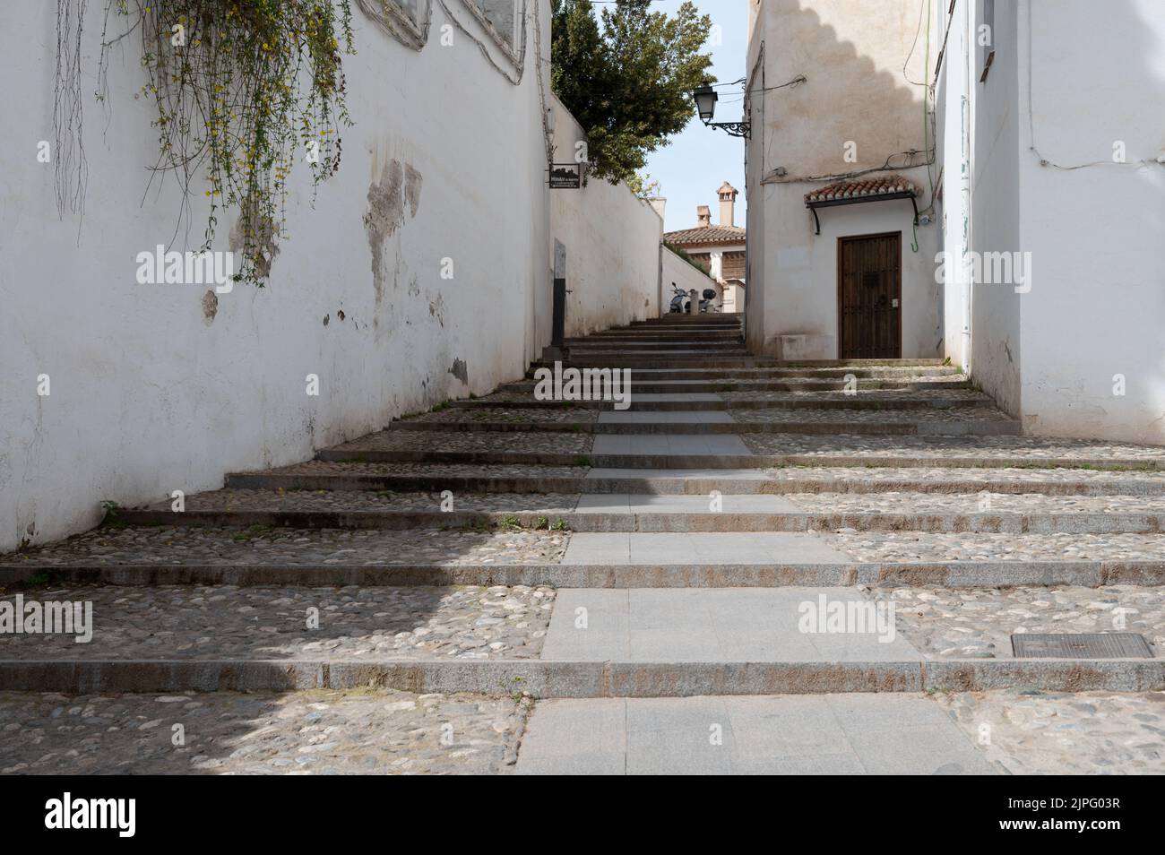 Walking in old central part of world heritage city Granada, Andalusia ...