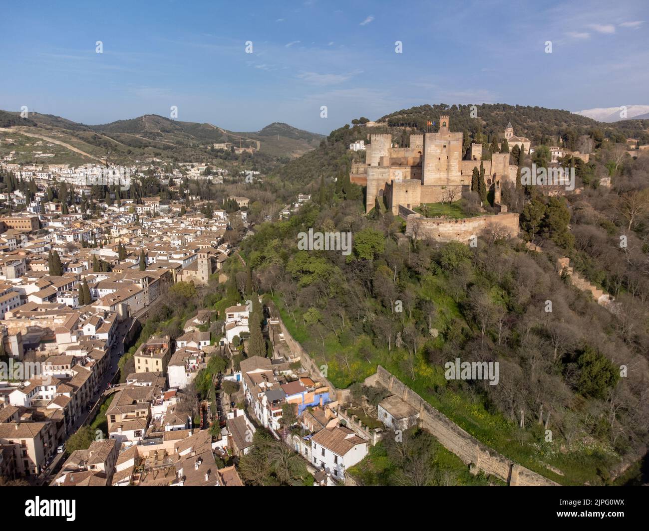 Aerial panoramic view on buildings, old district, mountains and ...