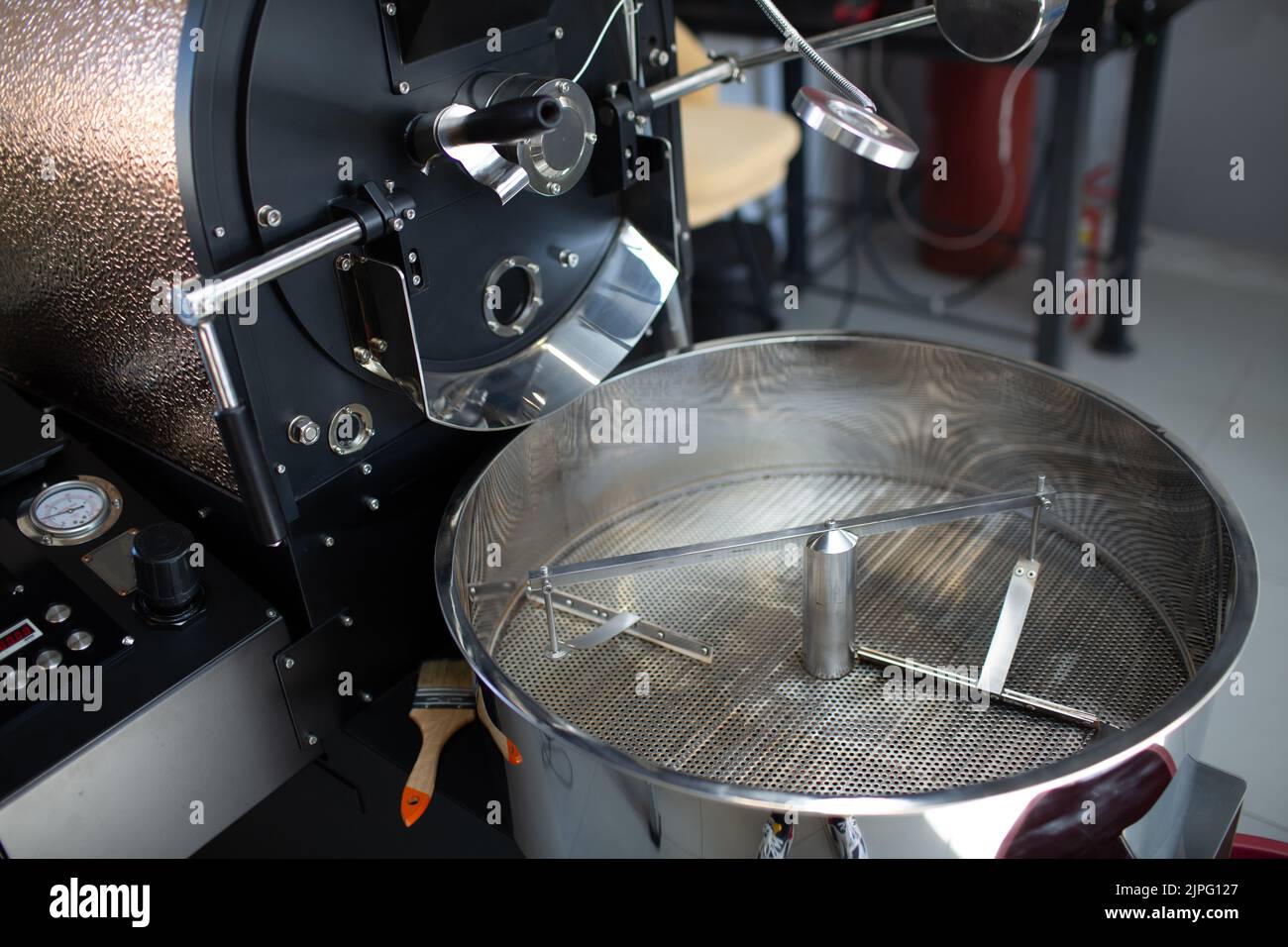 Coffee roaster machine at coffee roasting process Stock Photo - Alamy