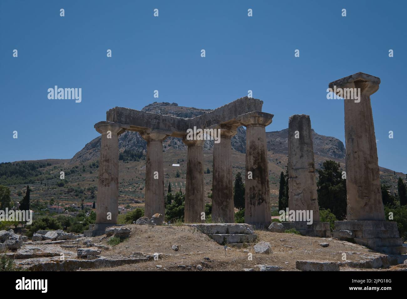 View of the Temple of Apollo in Ancient Corinth, Greece in summer Stock ...