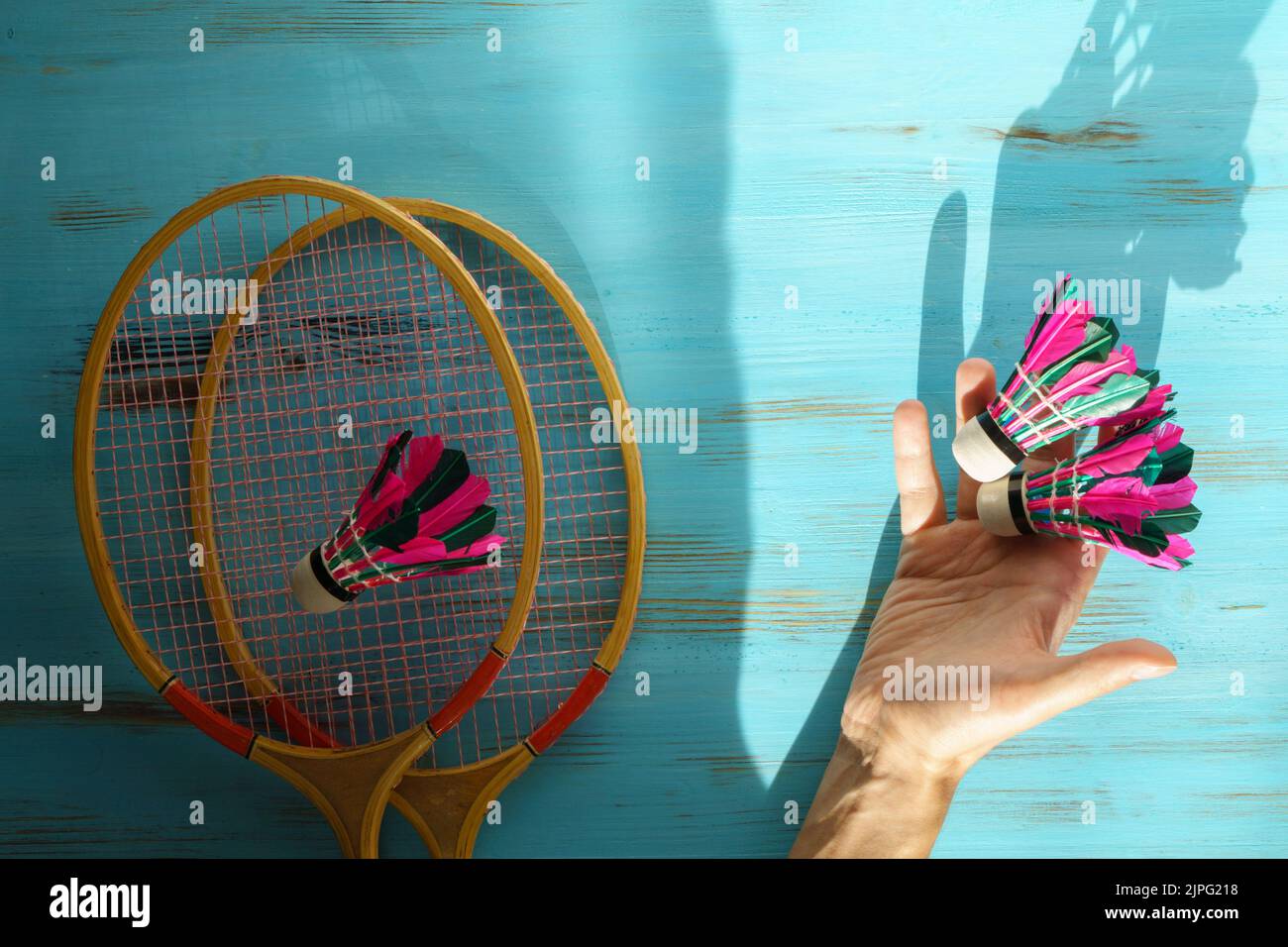 Conceptual idea with badminton rackets and a shuttlecock bird, on a ...