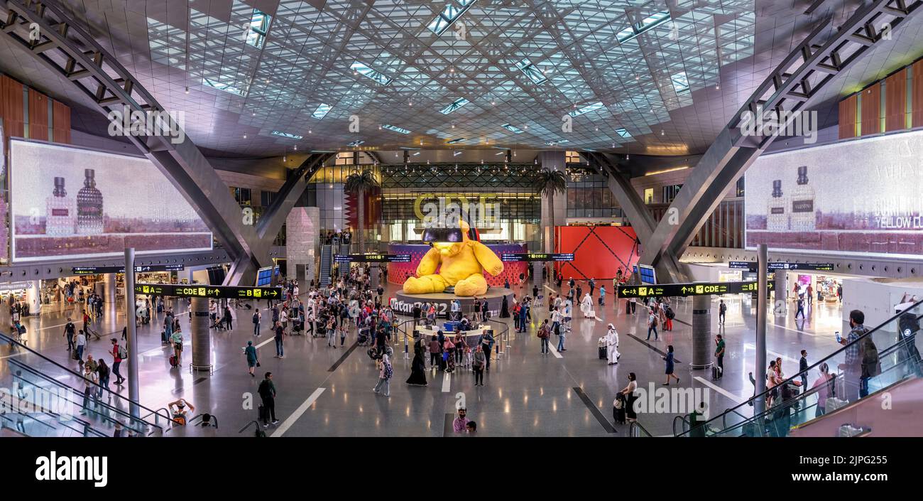 Interior of Hamad International Airport Terminal full of Tourist People ...