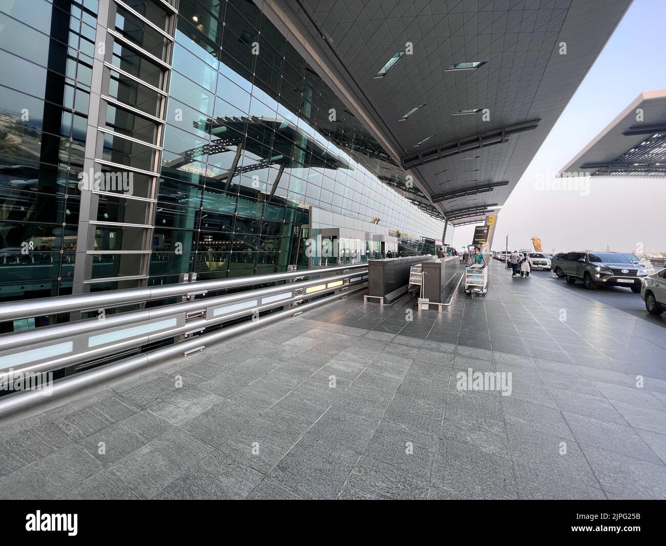 Interior of Hamad International Airport Terminal full of Tourist People ...