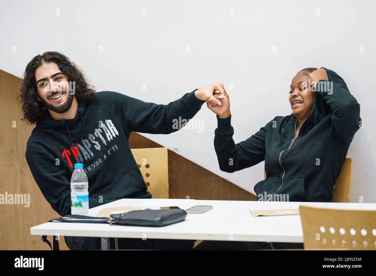 Mert Savas (left) and Paris Eockeray react after receiving their A ...