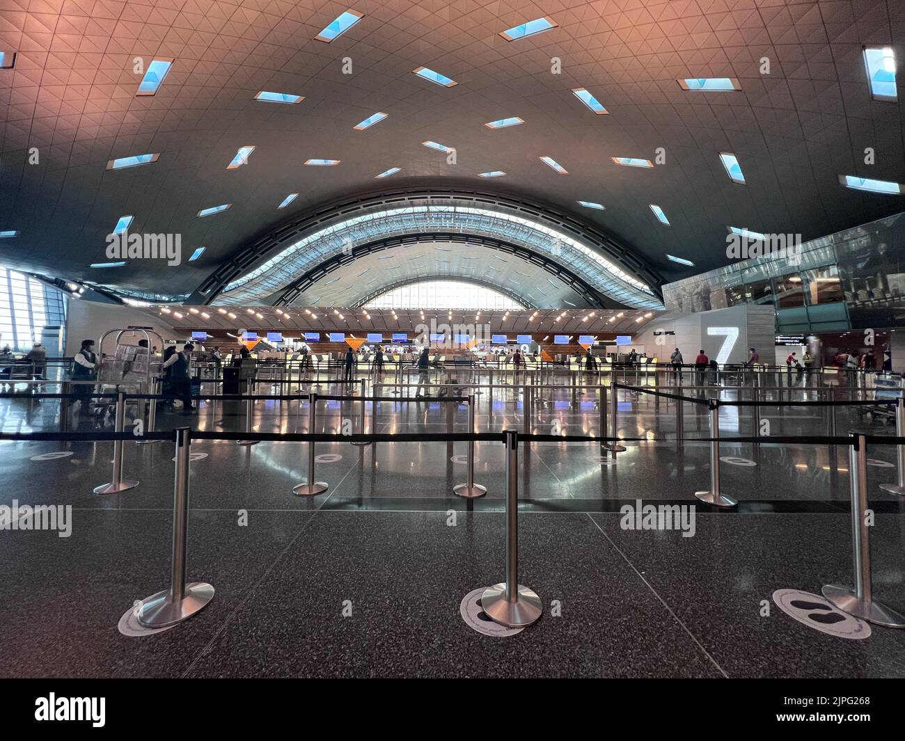 Interior of Hamad International Airport Terminal full of Tourist People ...