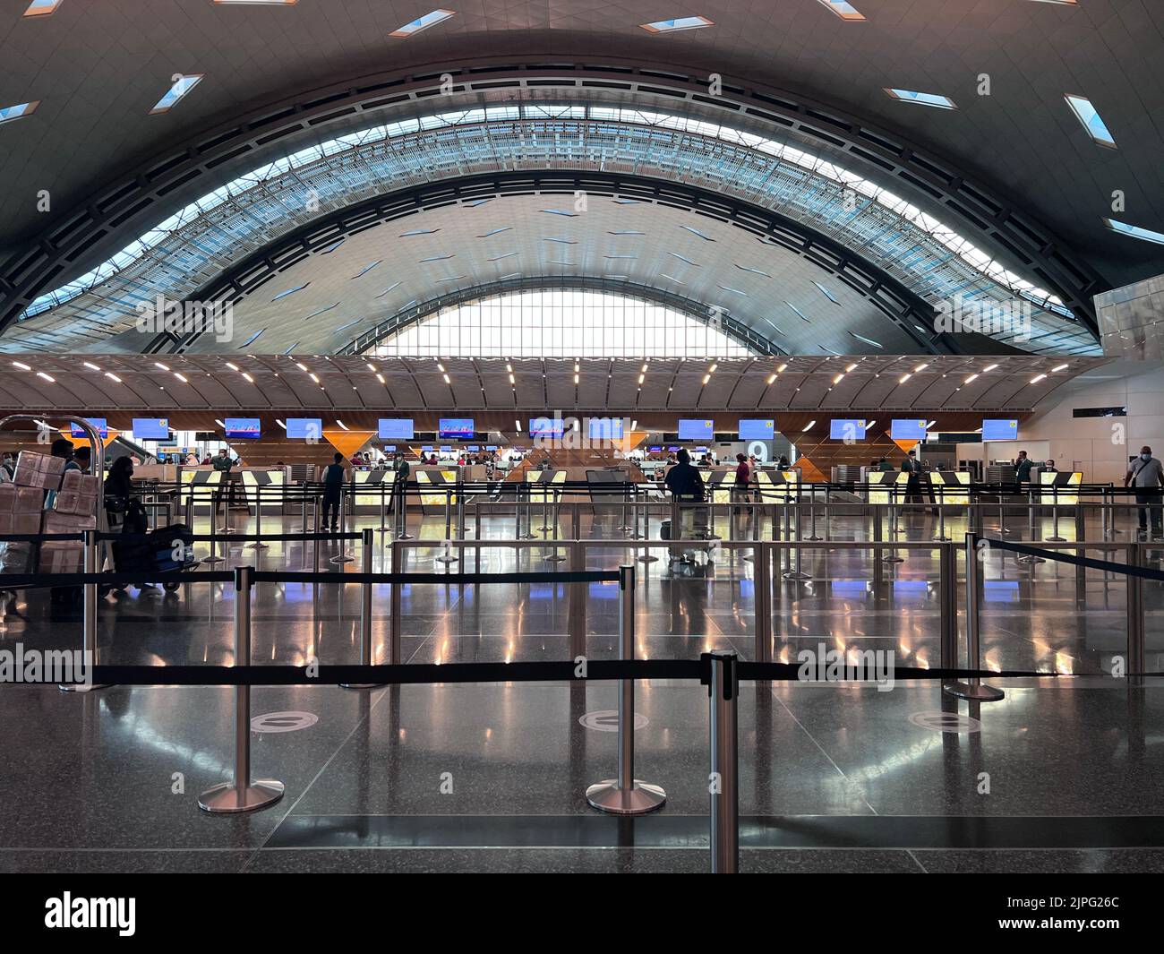 Interior of Hamad International Airport Terminal full of Tourist People ...