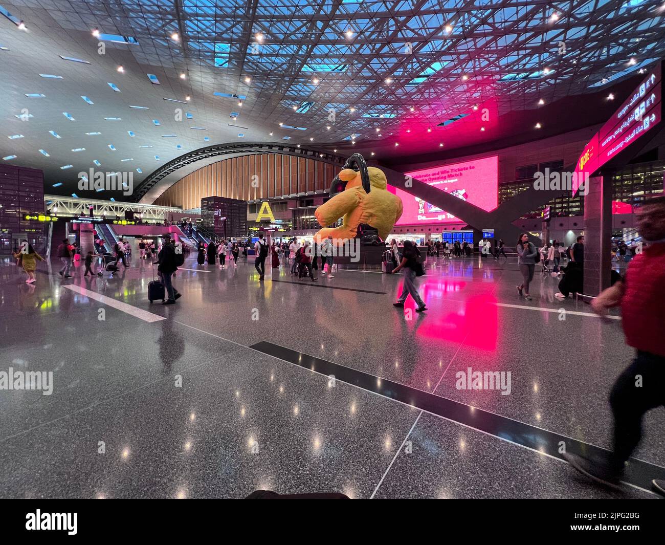 Interior of Hamad International Airport Terminal full of Tourist People ...