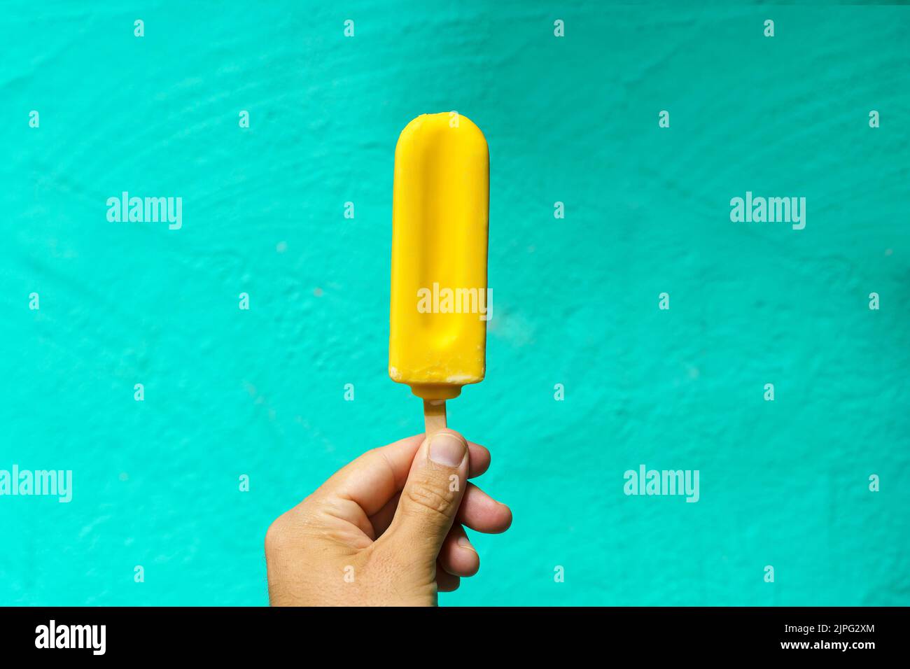 Ice cream cone in hand on minimal color background isolated. Summer ...