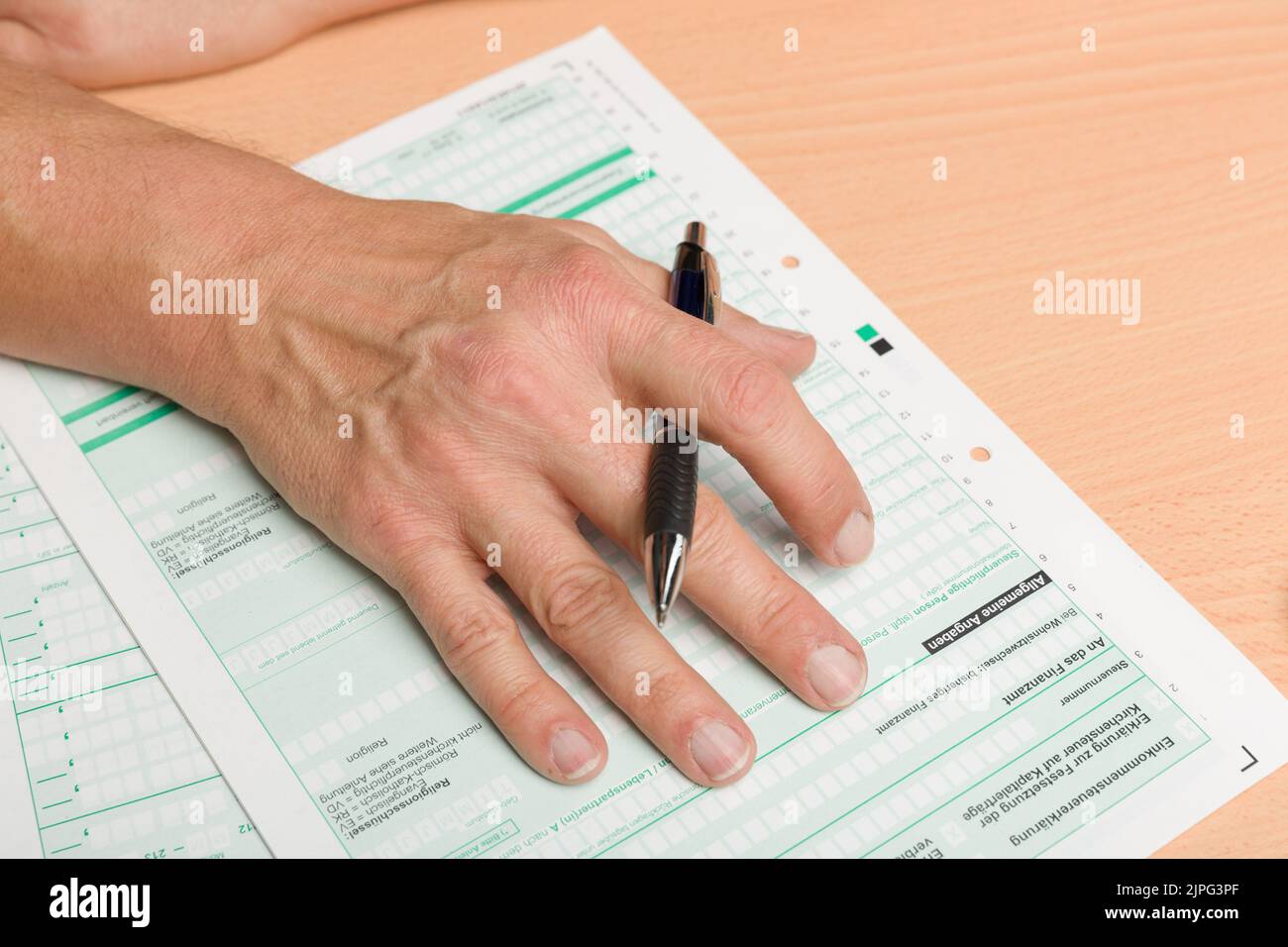 close-up of completing, processing, editing a tax declaration form ...