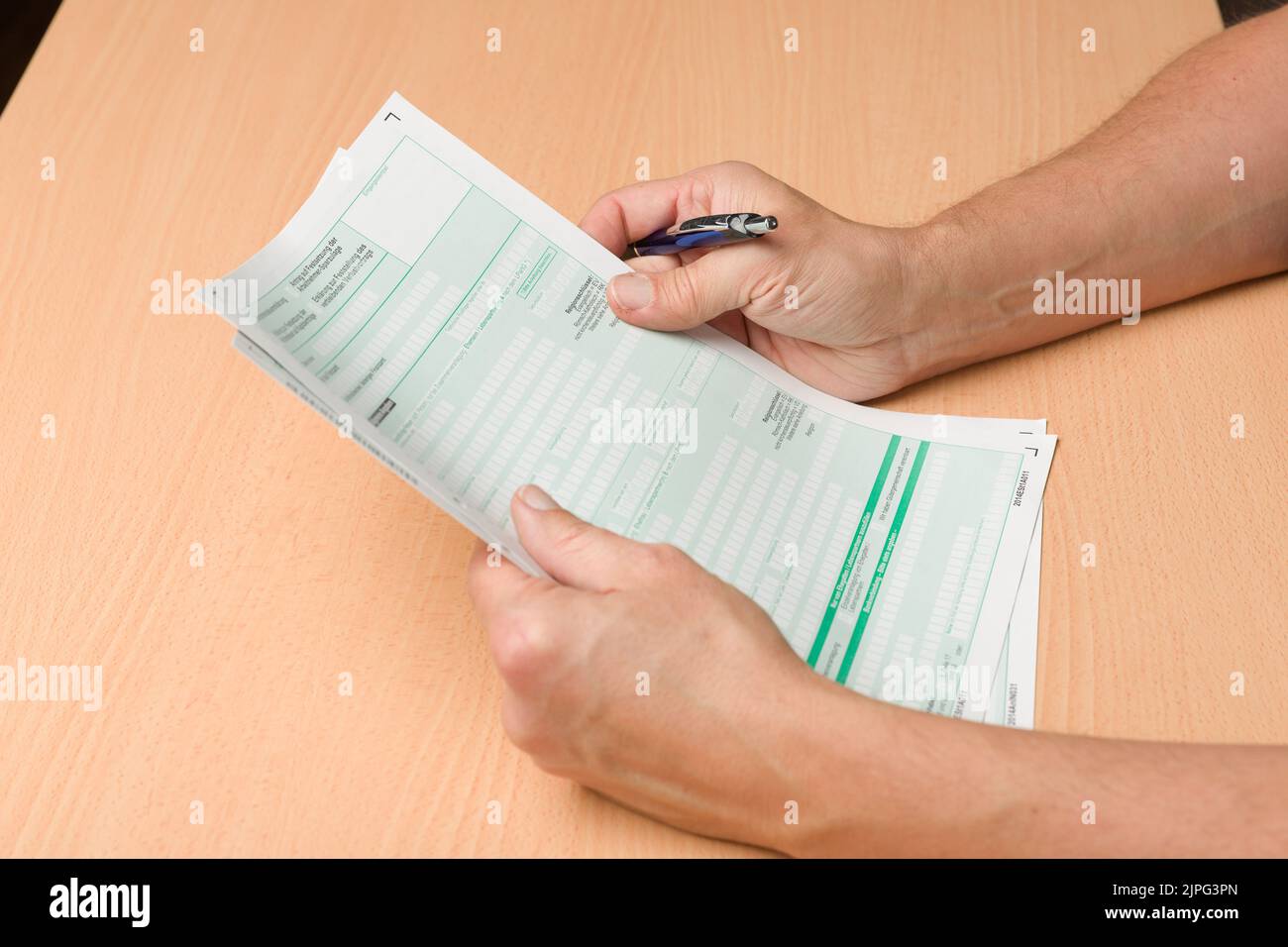 close-up of a hand holding an empty paper tax delaration form Stock ...