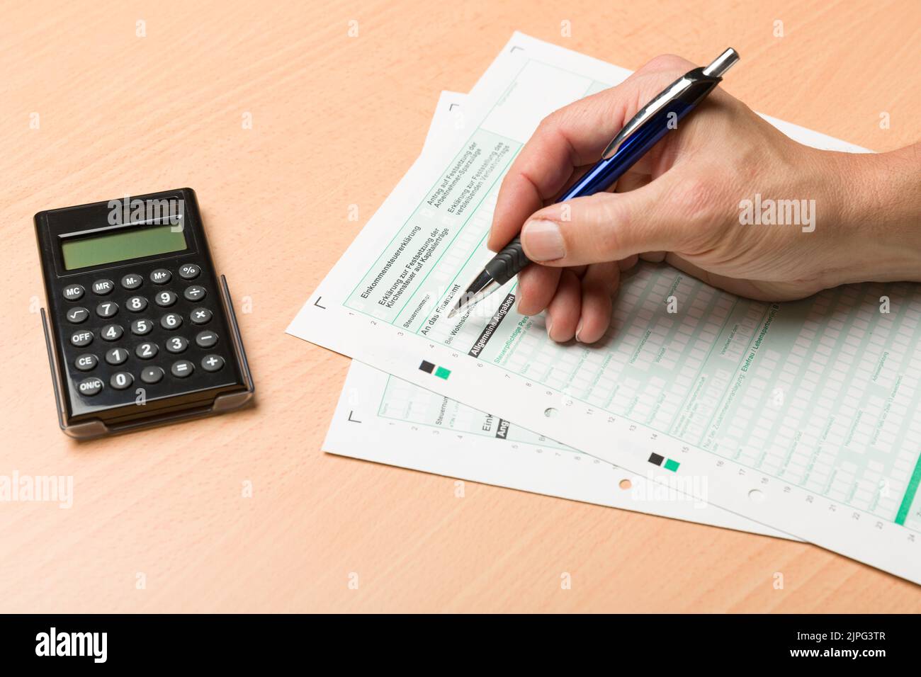 close-up of completing, processing, editing a tax declaration form ...