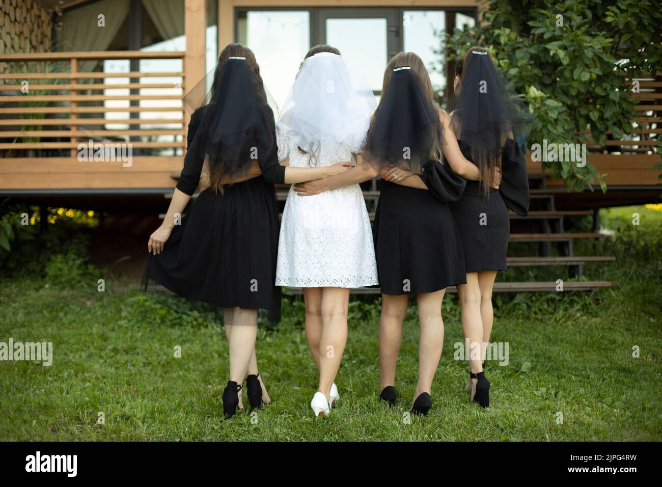 Bride and friends. Girls in dresses. Black and white clothes on women ...