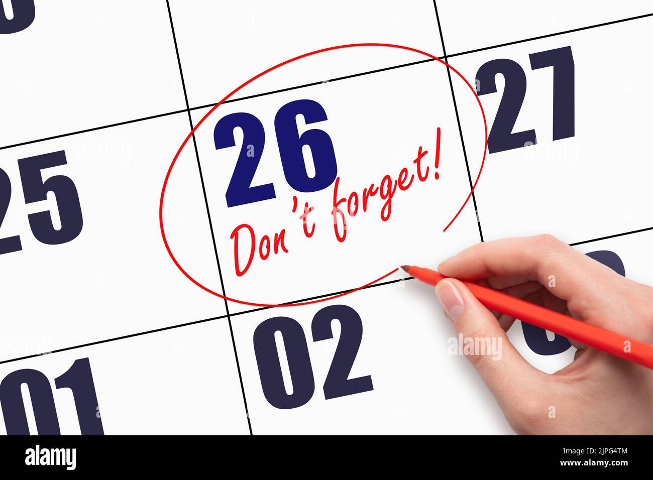 26th day of the month. Hand writing text DO NOT FORGET and circling the ...