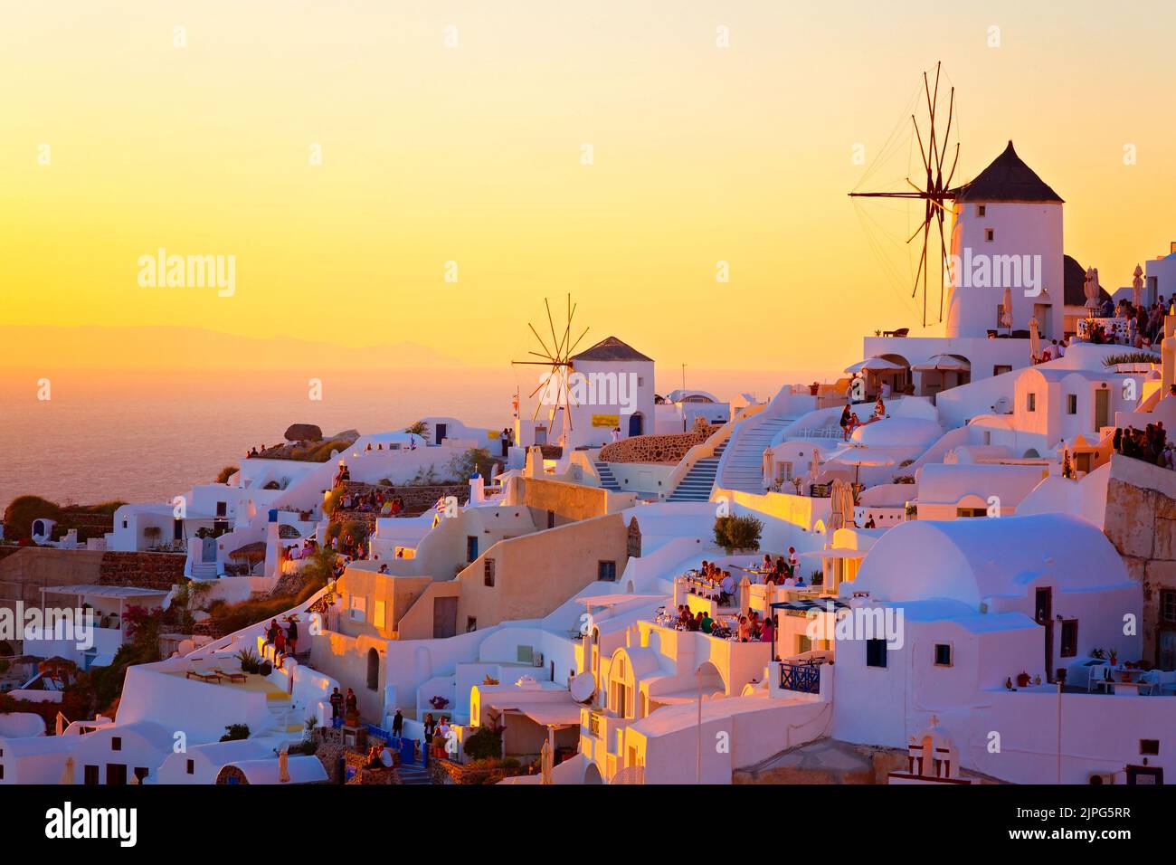 Santorini during sunset, view over traditional village Oia, Cyclades ...