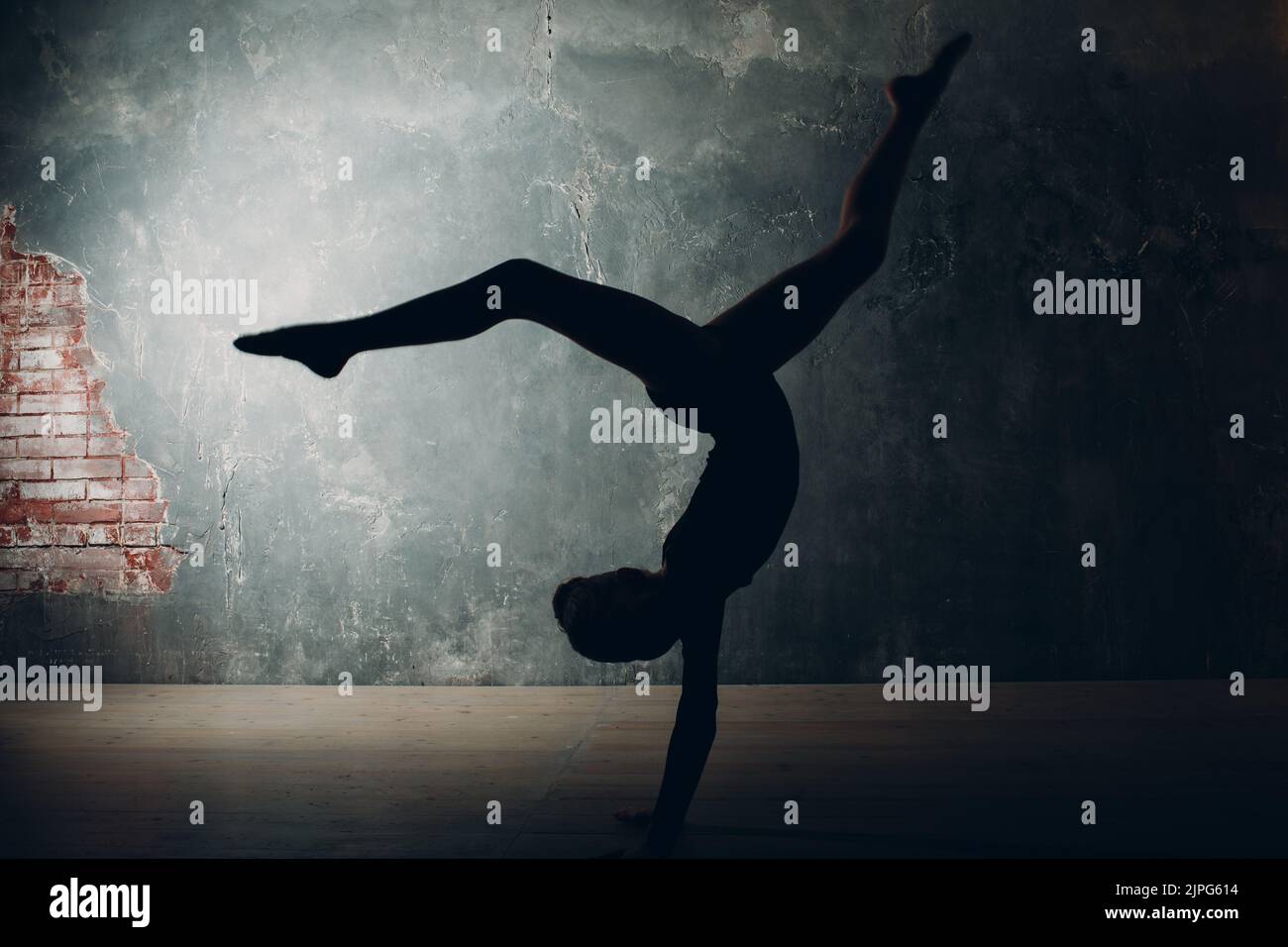 Young girl professional gymnast woman dance rhythmic gymnastics at ...