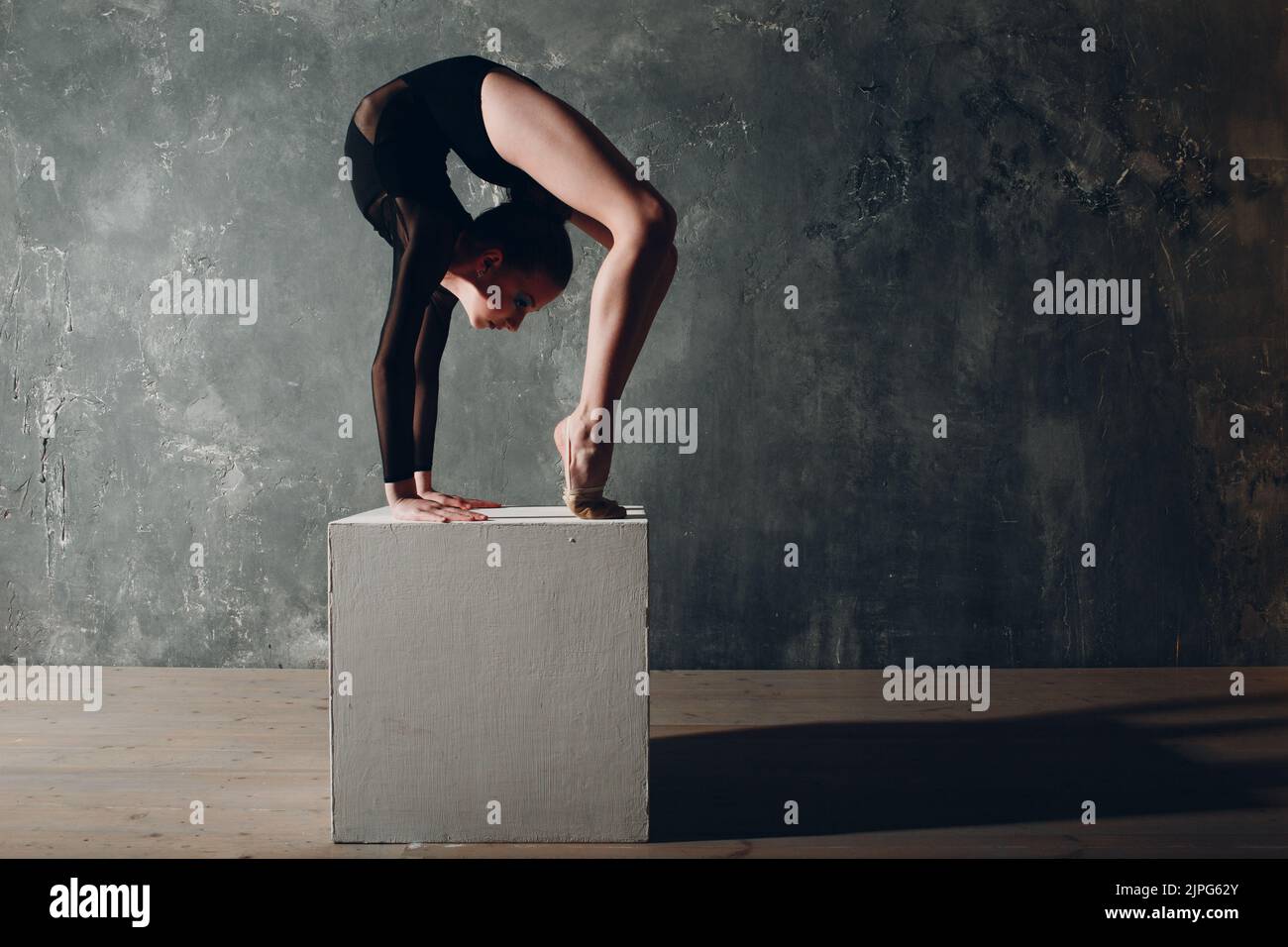 Young girl professional gymnast woman dance rhythmic gymnastics with ...