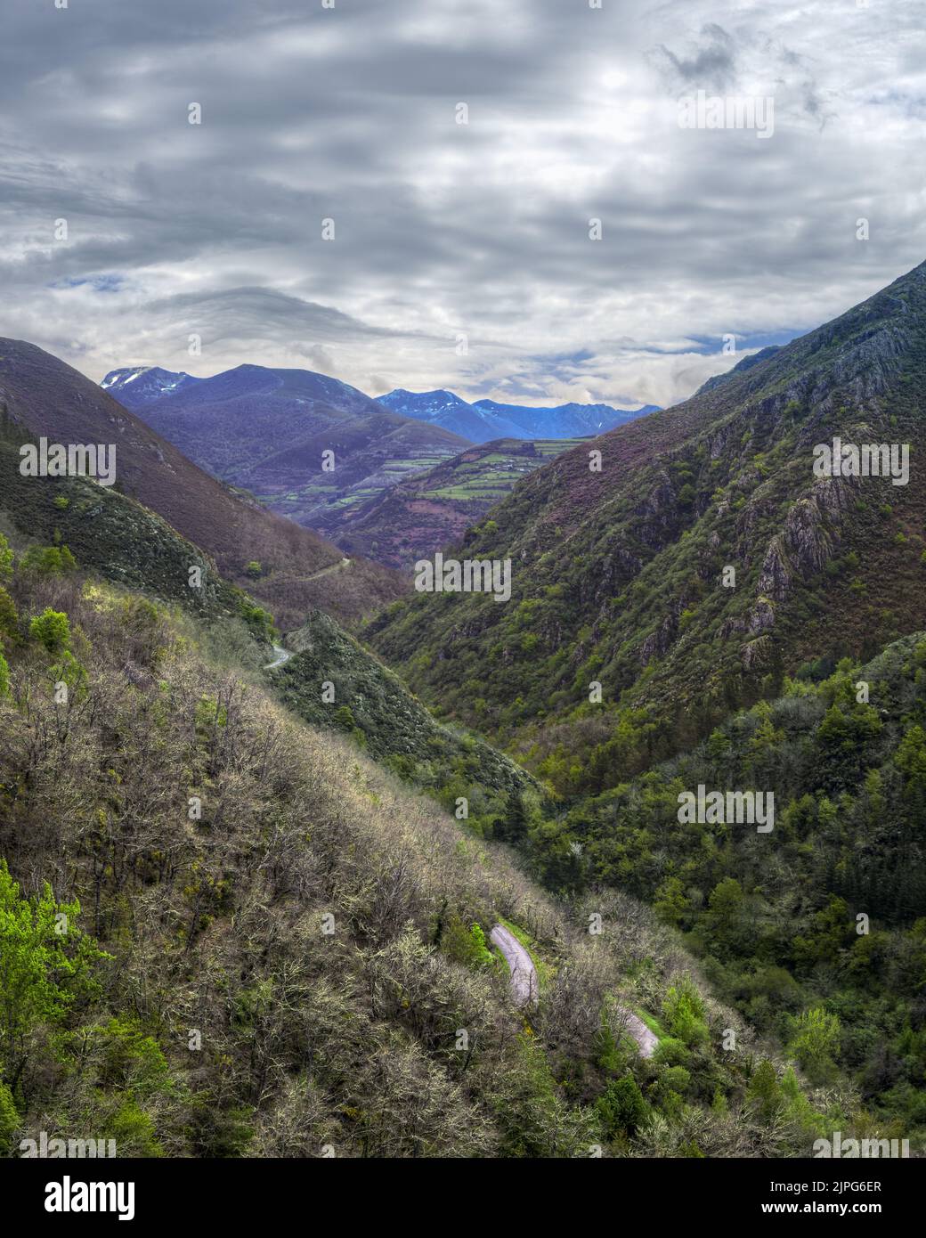 View towards the peaks of the Ancares Range across the Ser river valley ...