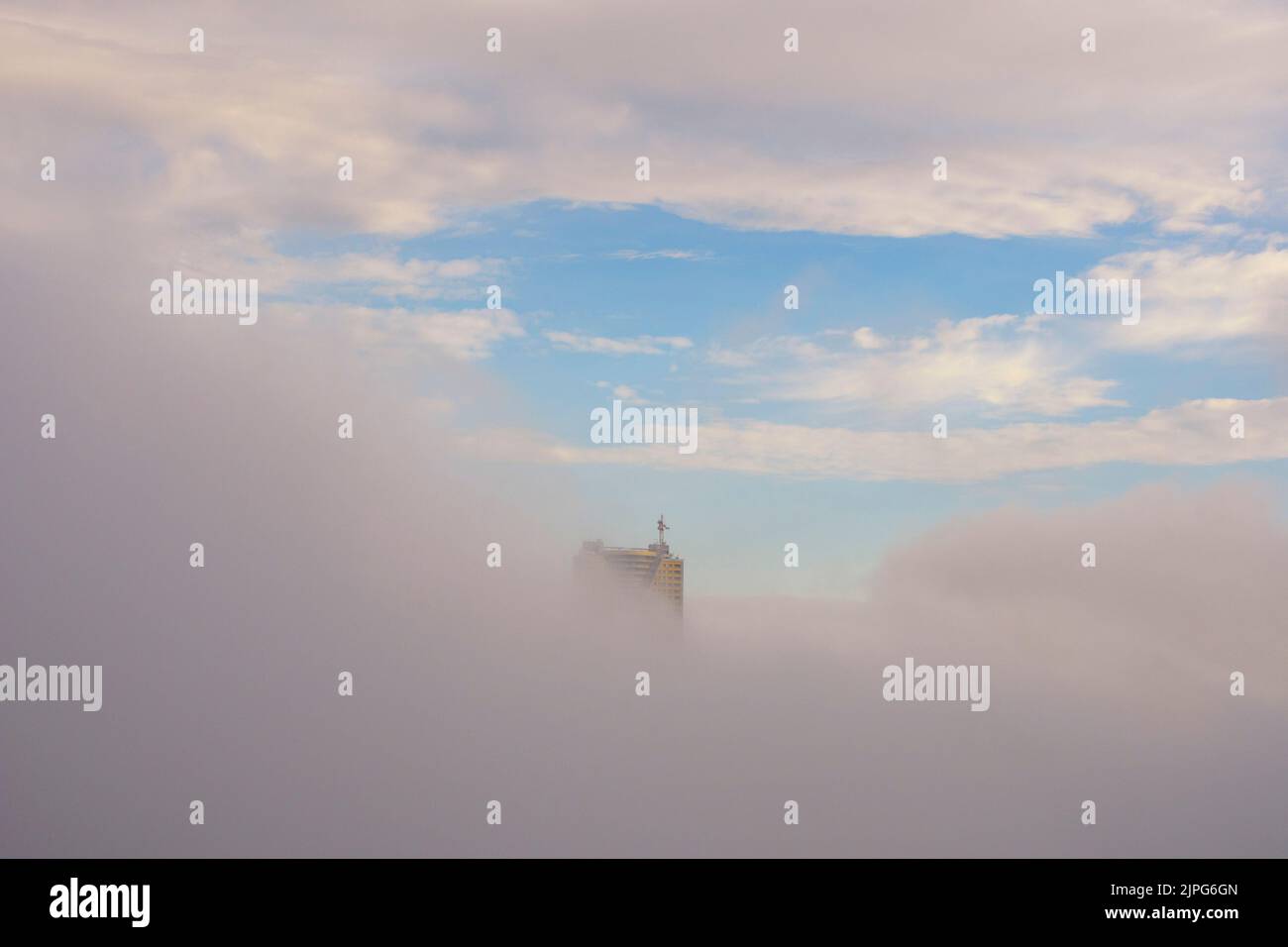 The top of the Intempo skyscraper rises above the fog in Benidorm ...