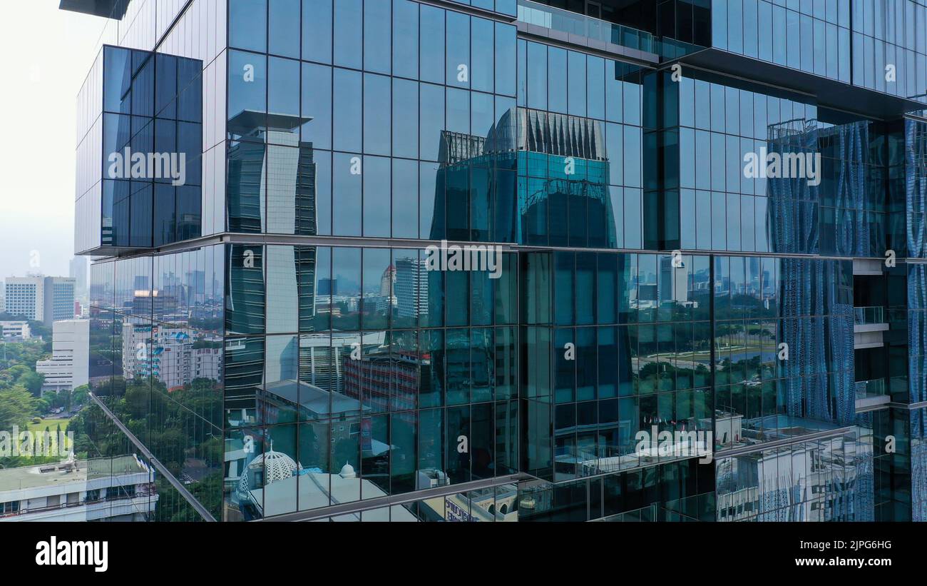 Drone vertical flight among the modern futuristic skyscrapers in ...