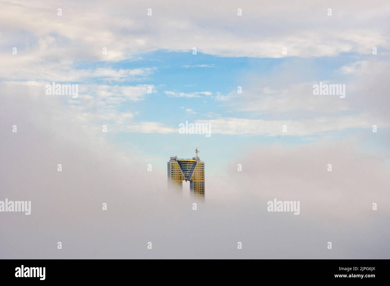 The top of the Intempo skyscraper rises above the fog in Benidorm ...