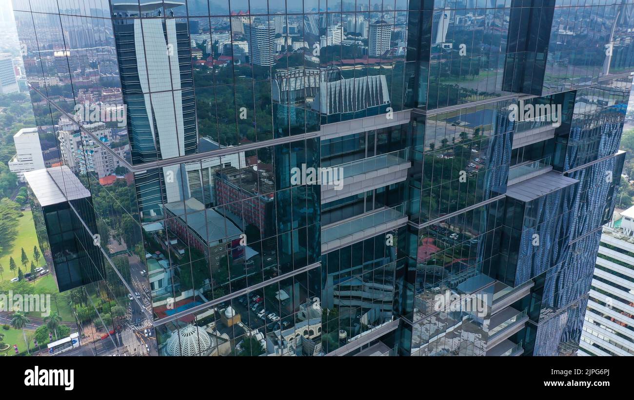 Drone vertical flight among the modern futuristic skyscrapers in ...