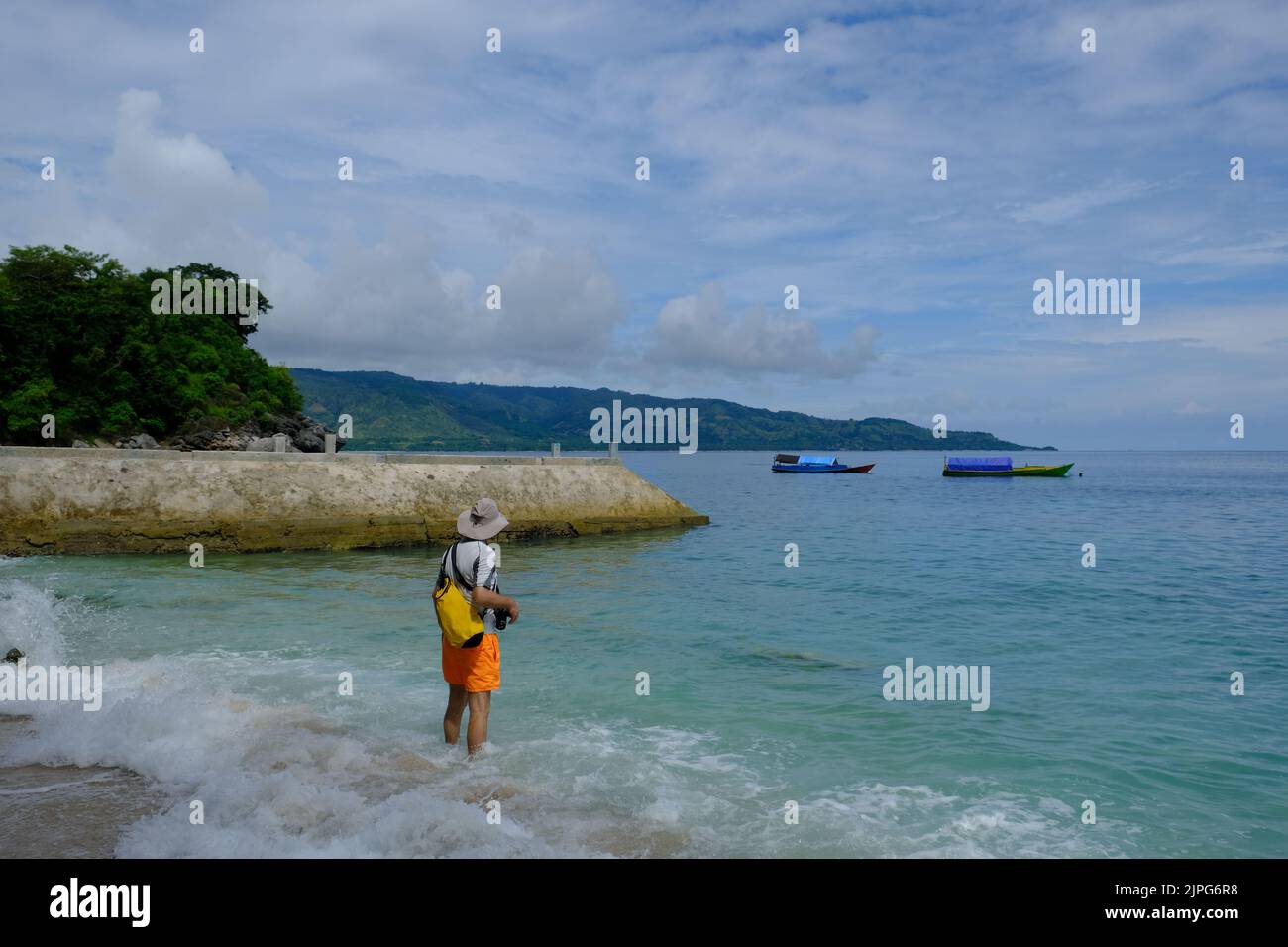 Indonesia Alor Island - Coastline landscape wit beach and fishing boats ...