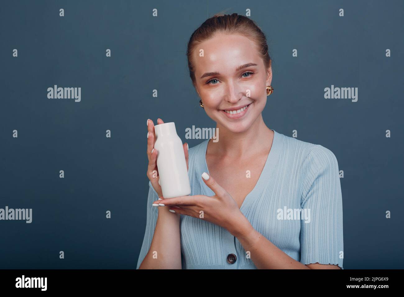 Pretty young woman hold white bottle template blank empty space ... Pretty young woman hold white bottle template blank empty space ...