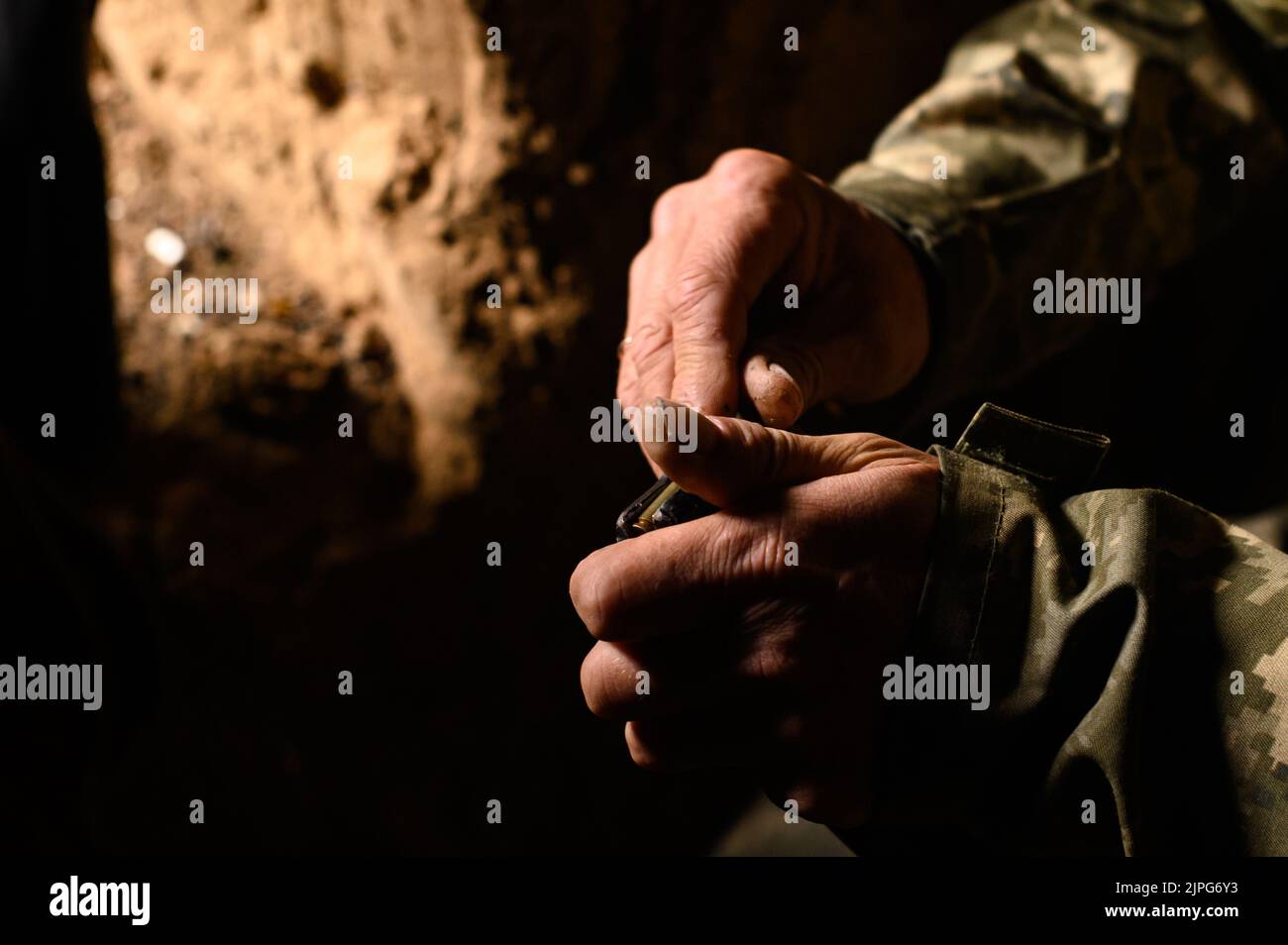 Filling the magazine with combat military assault rifles AK 74, a ...