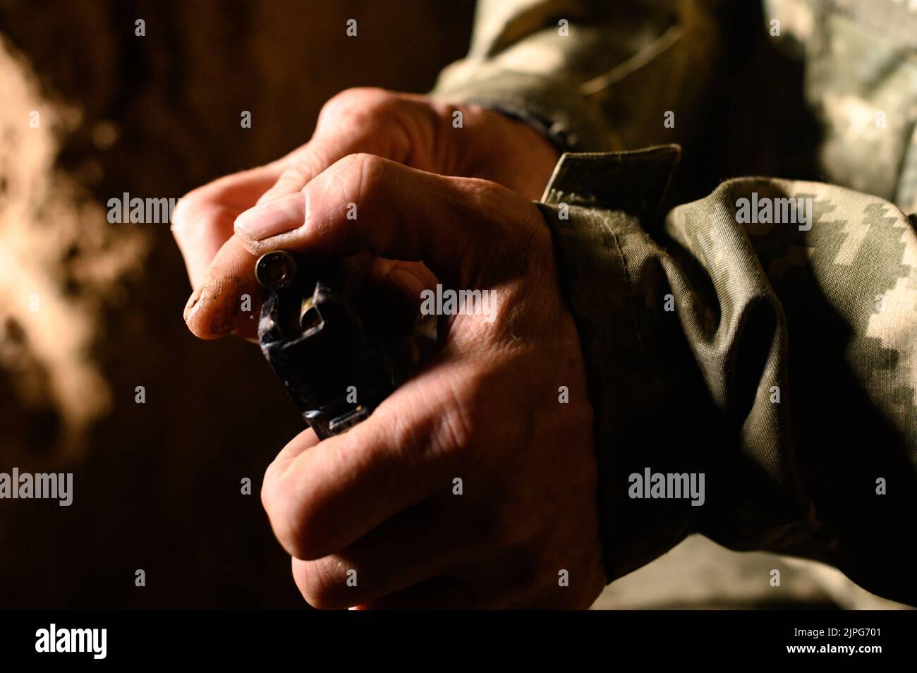 Filling the magazine with combat military assault rifles AK 74, a ...