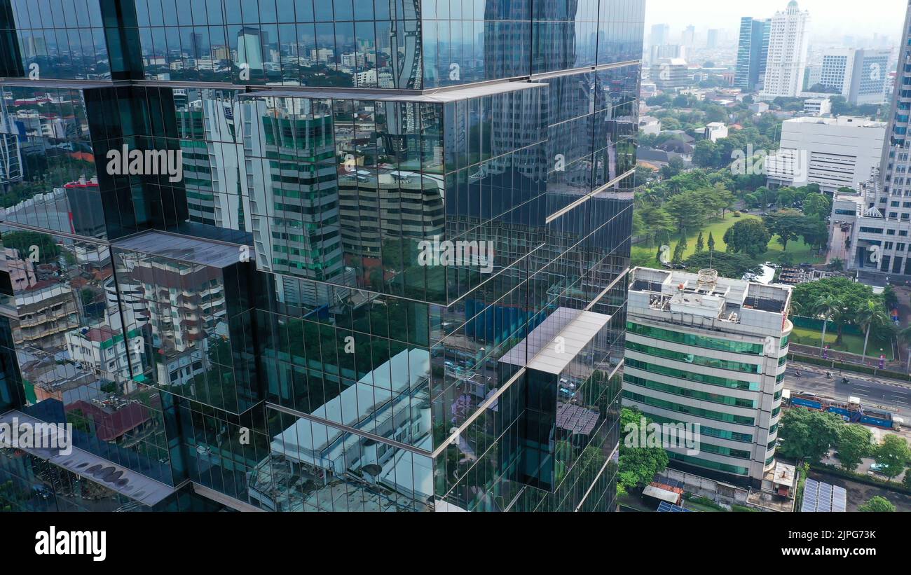Drone vertical flight among the modern futuristic skyscrapers in ...