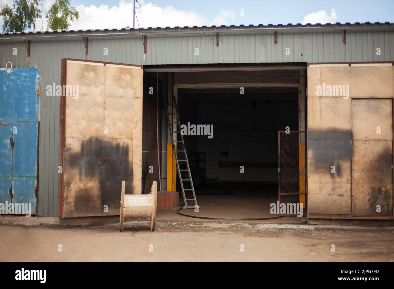 Garage door. Entrance to warehouse. Large gate to building. Industrial ...
