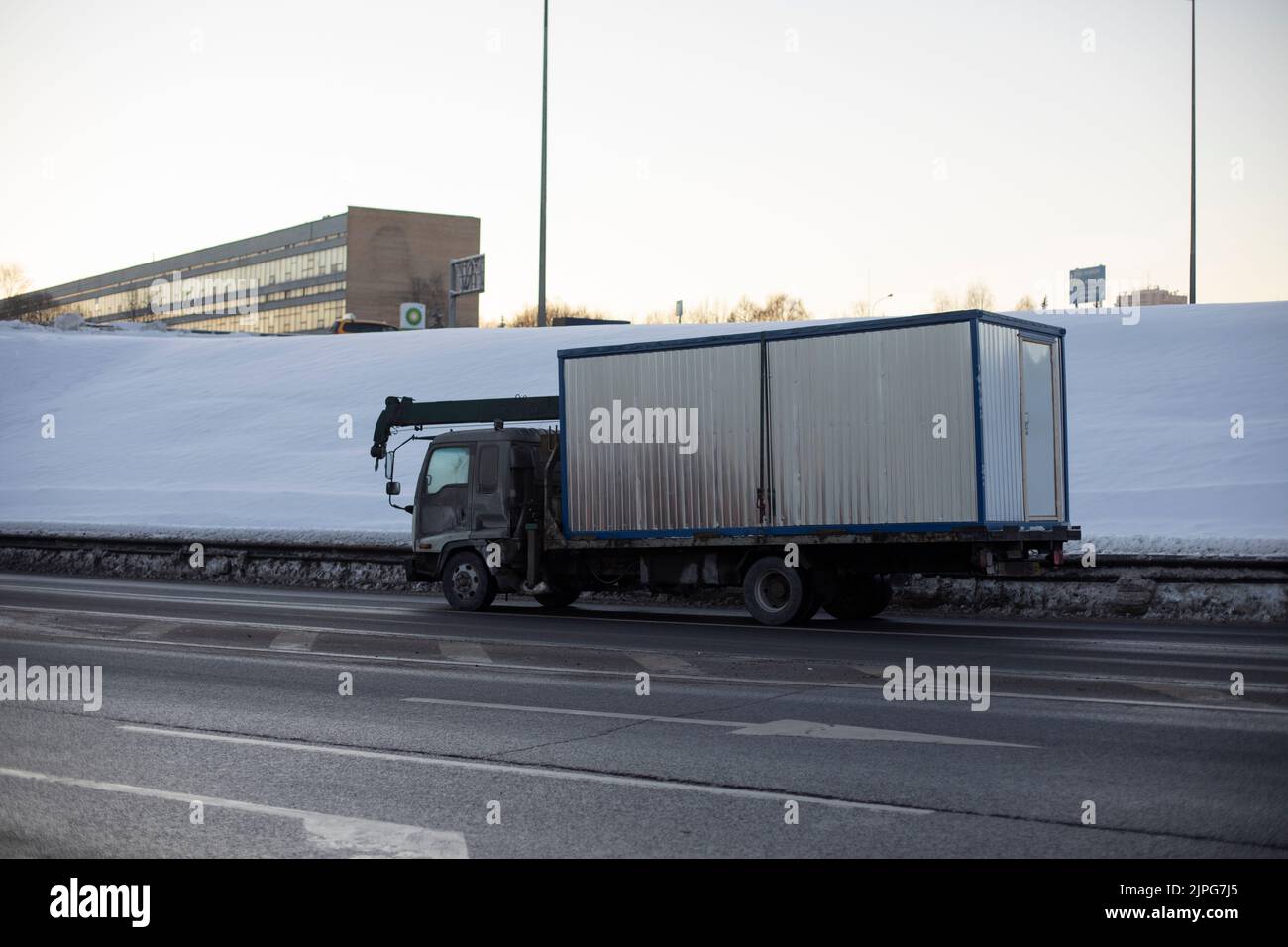 Truck carries container. Transport on road. Car on highway Stock Photo ...