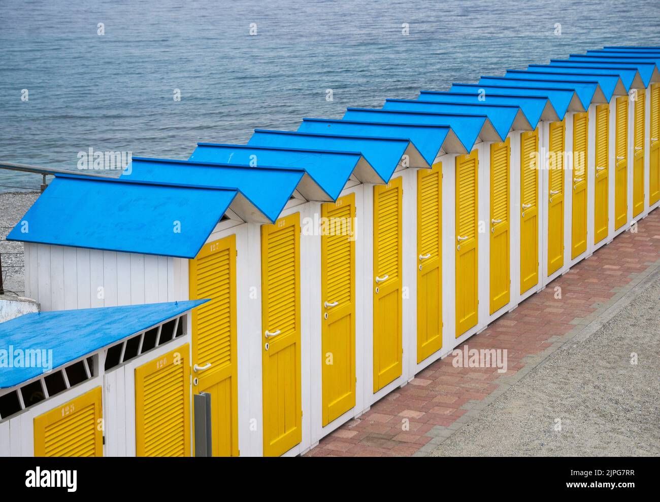 row of beach huts in front of the sea Stock Photo - Alamy