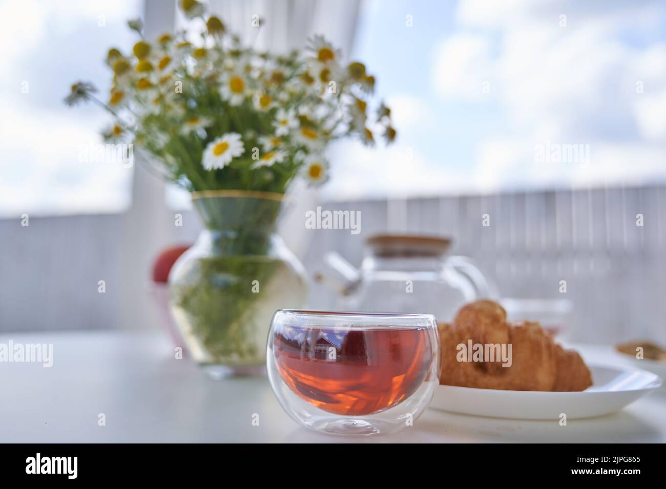 Transparent glass Cup of tea in nature. The concept of breakfast in the ...