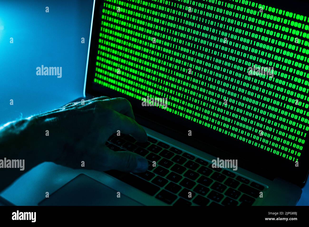 Hand Typing On Laptop Keyboard Green Numbers On Display Hacker