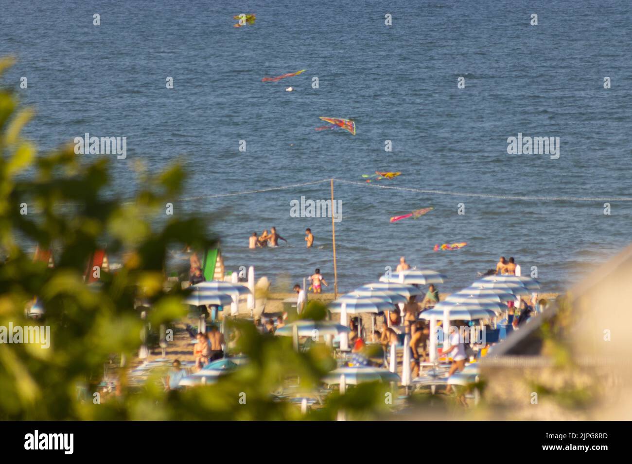 Beach with bathers in summer. Rimini, Italy Stock Photo - Alamy