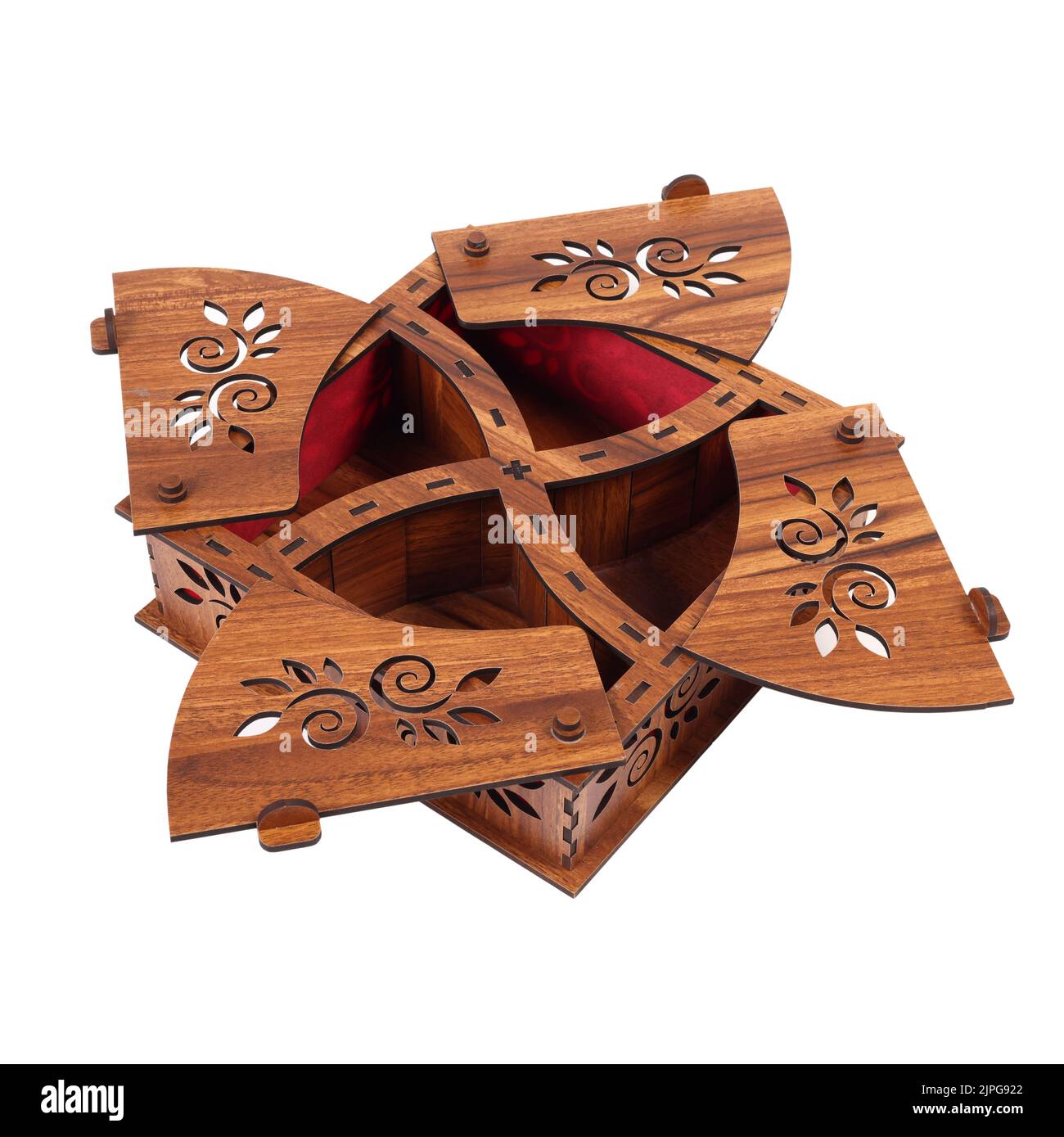 A wooden laser cut open jewelry box with floral ornaments isolated on ...
