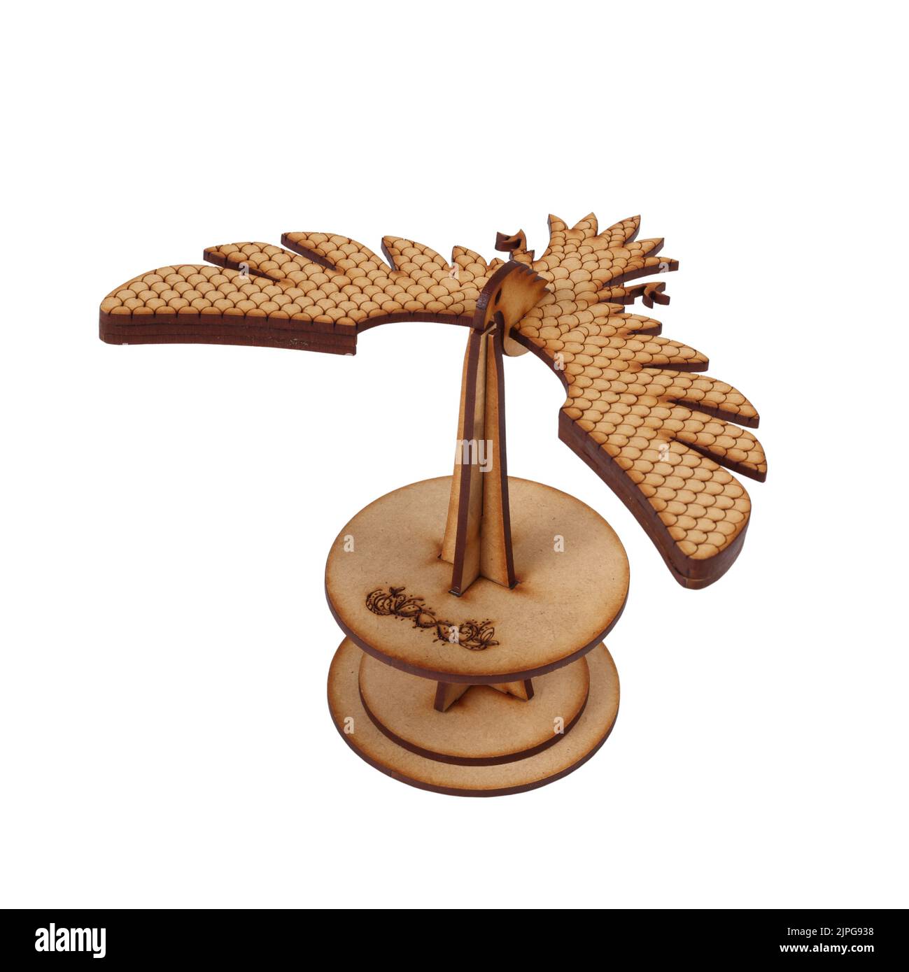 A wooden laser cut balancing bird isolated on white background Stock ...