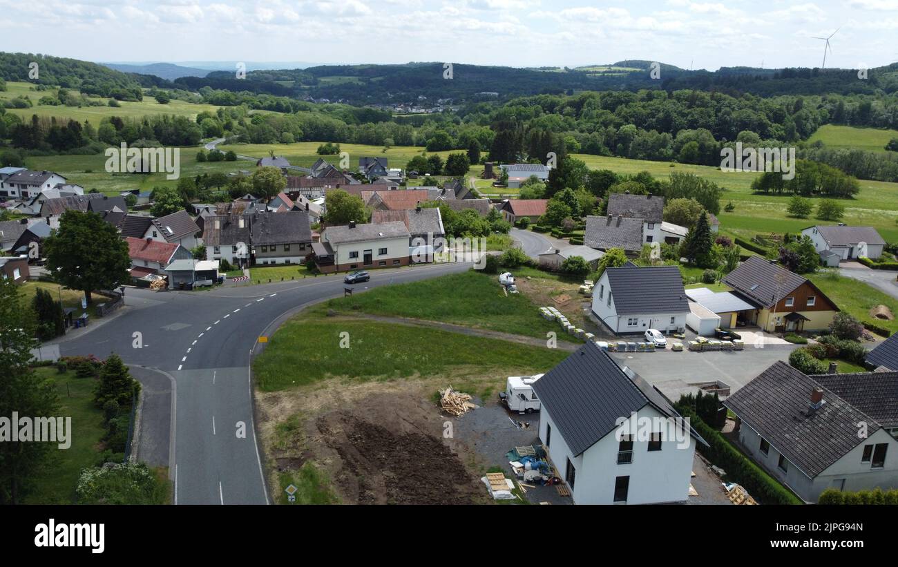 An aerial view of modern buildings surrounded by trees Stock Photo - Alamy